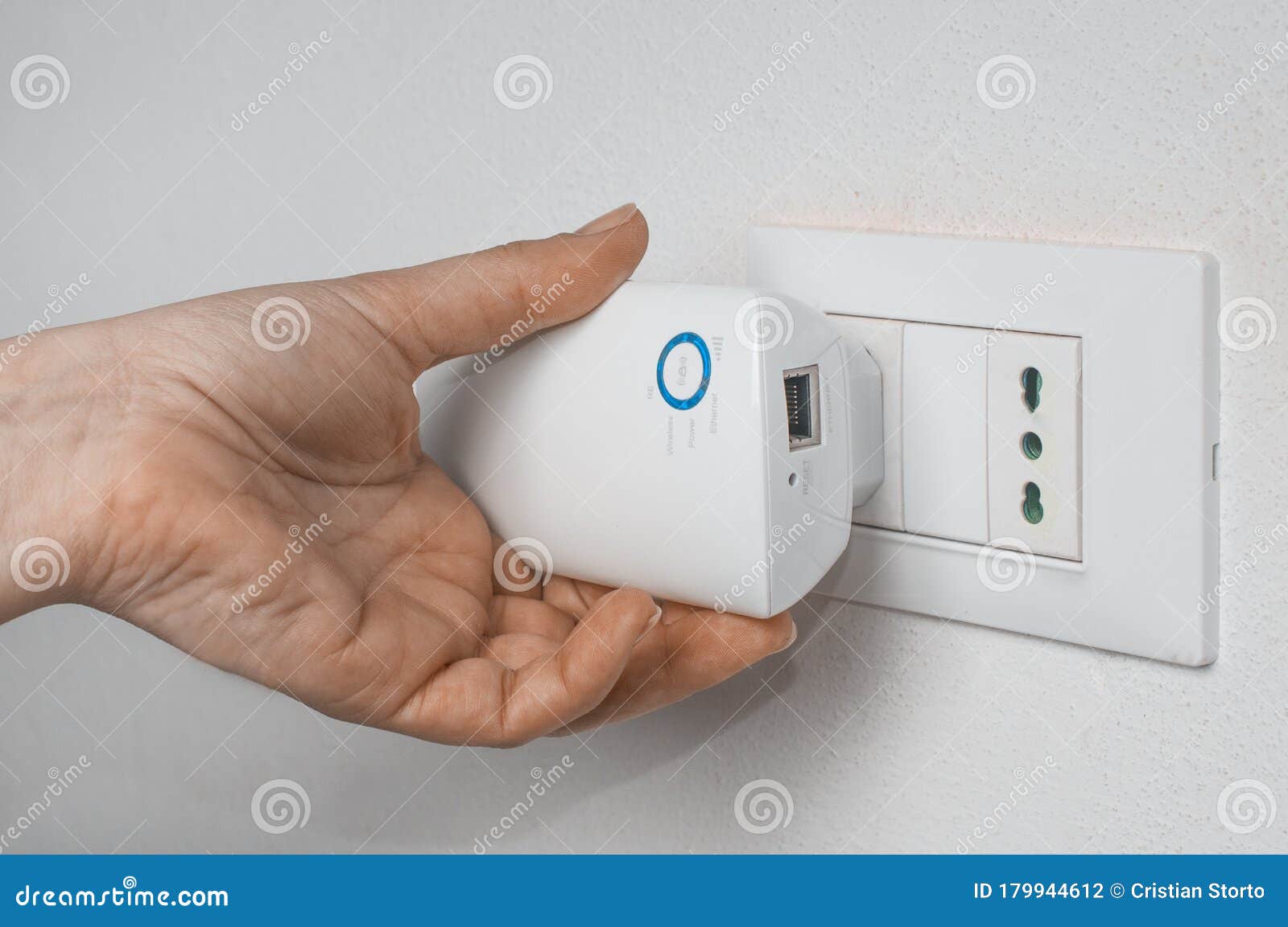 Woman Plug a Wifi Repeater on a Wall Plug Stock Photo - Image of white ...