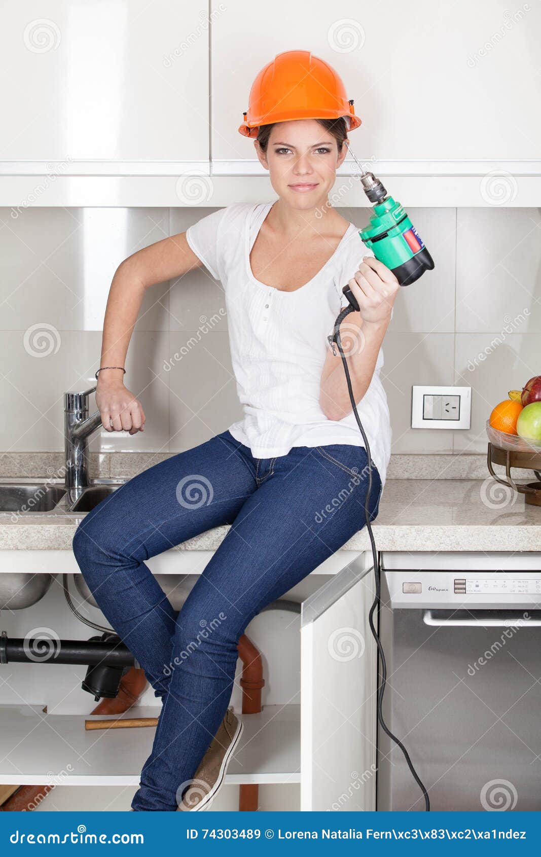 Woman plumbing with drill stock image. Image of smiling - 74303489