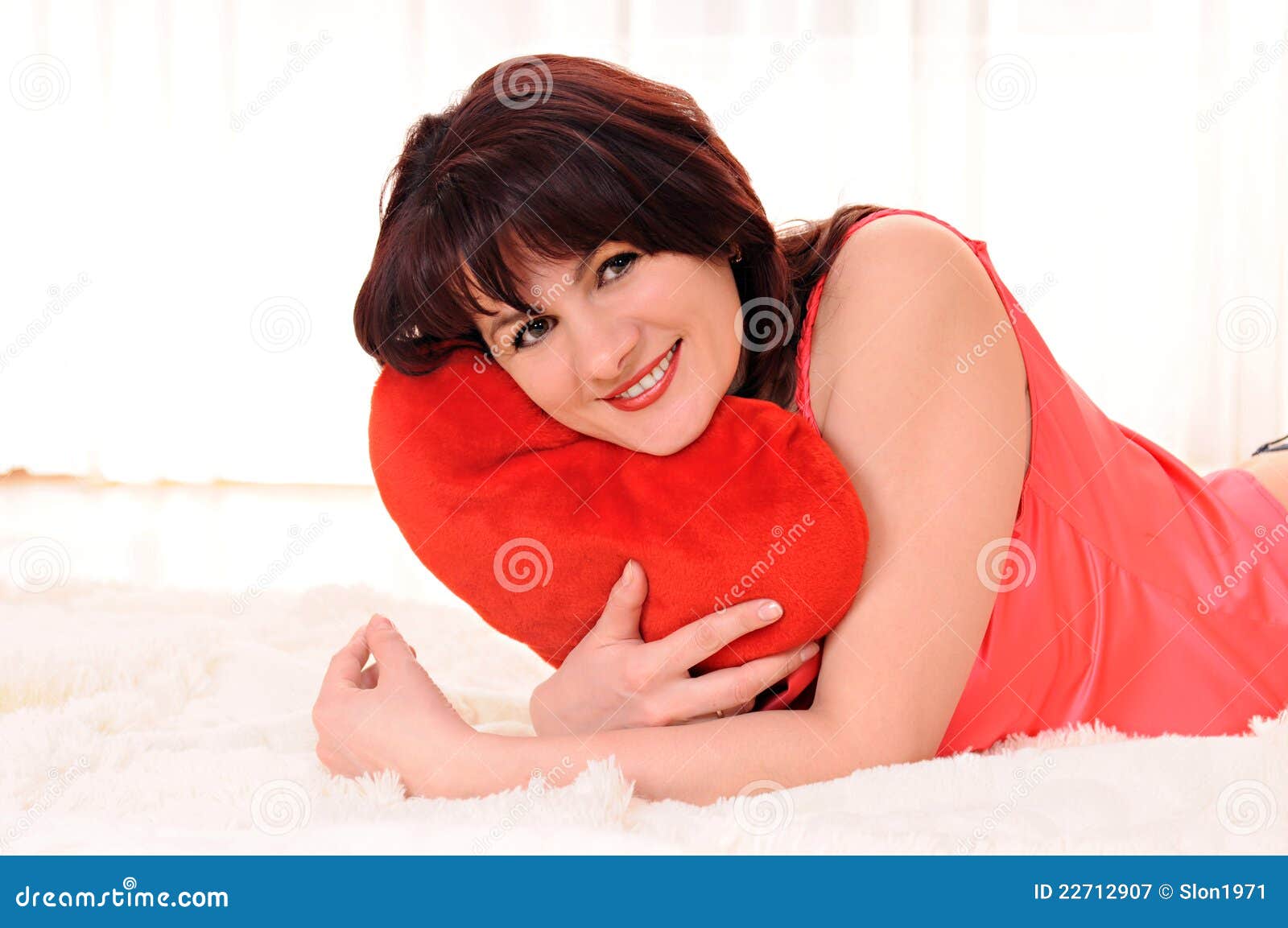 Woman with plush heart stock image. Image of joyful, looking - 22712907