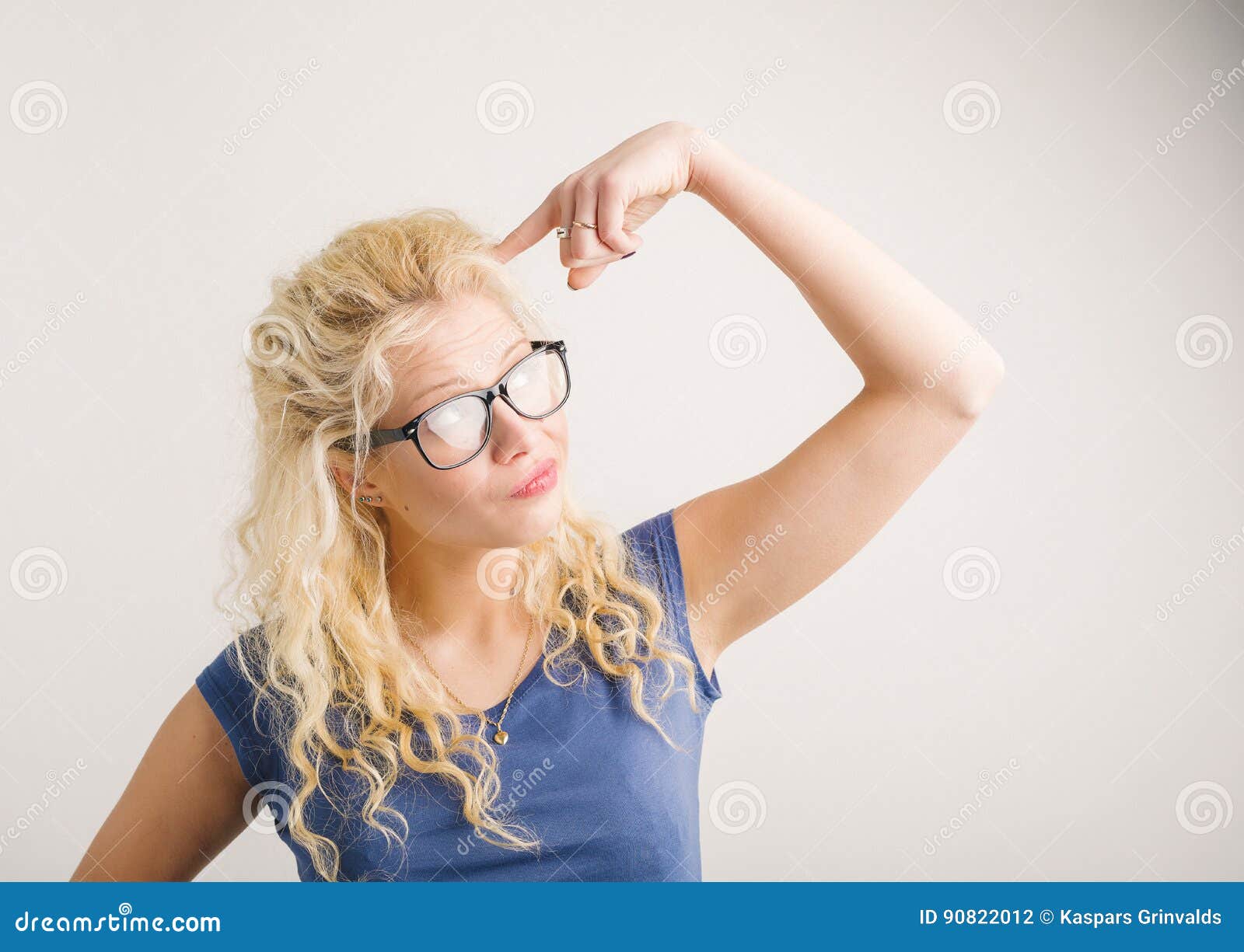 Woman Pointing Her Finger at Her Head Stock Photo - Image of studio ...