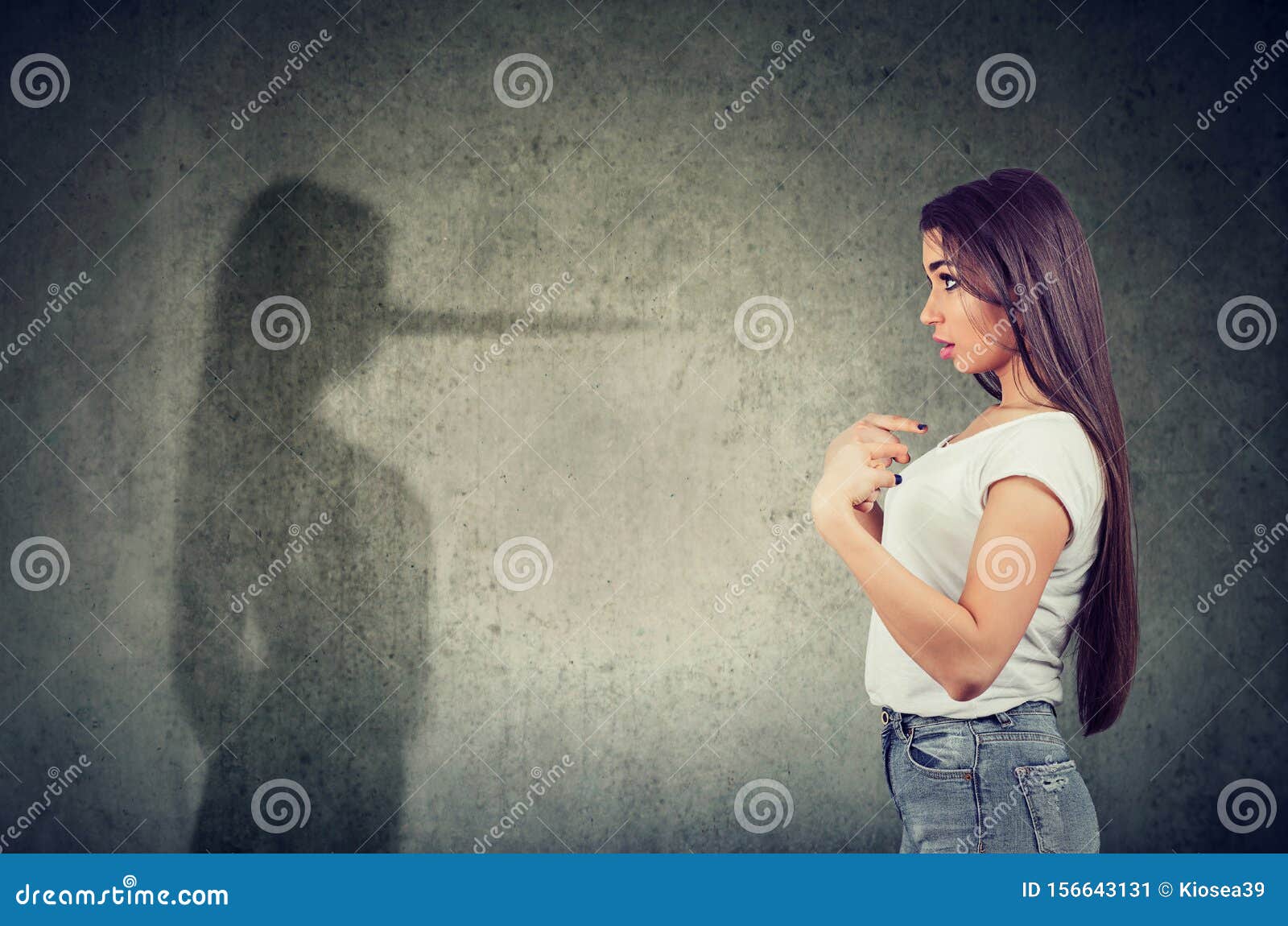 Woman Pointing at Herself Looking at a Shadow with Long Nose of a Liar ...