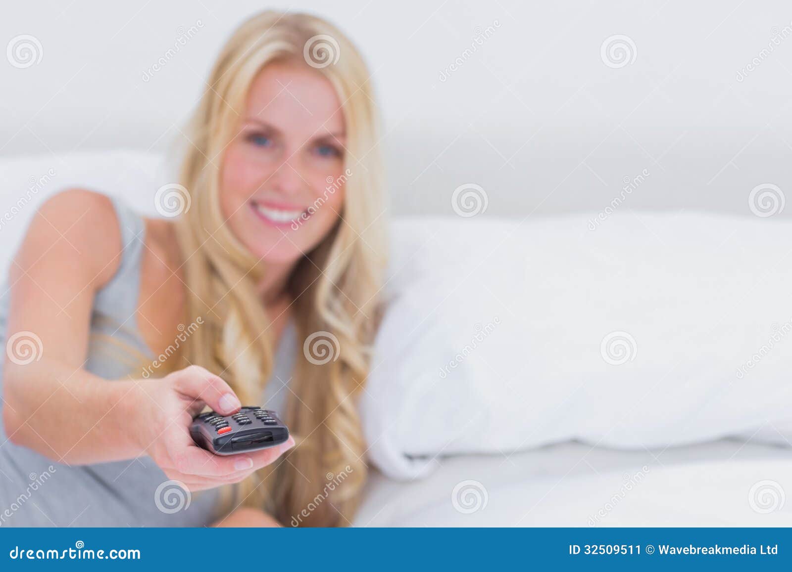 Woman Pointing the Remote Control at the Camera Stock Image - Image of ...