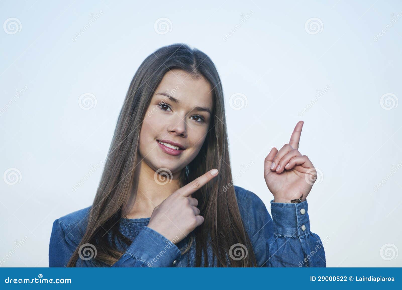 Woman pointing and smiling stock photo. Image of confidence - 29000522