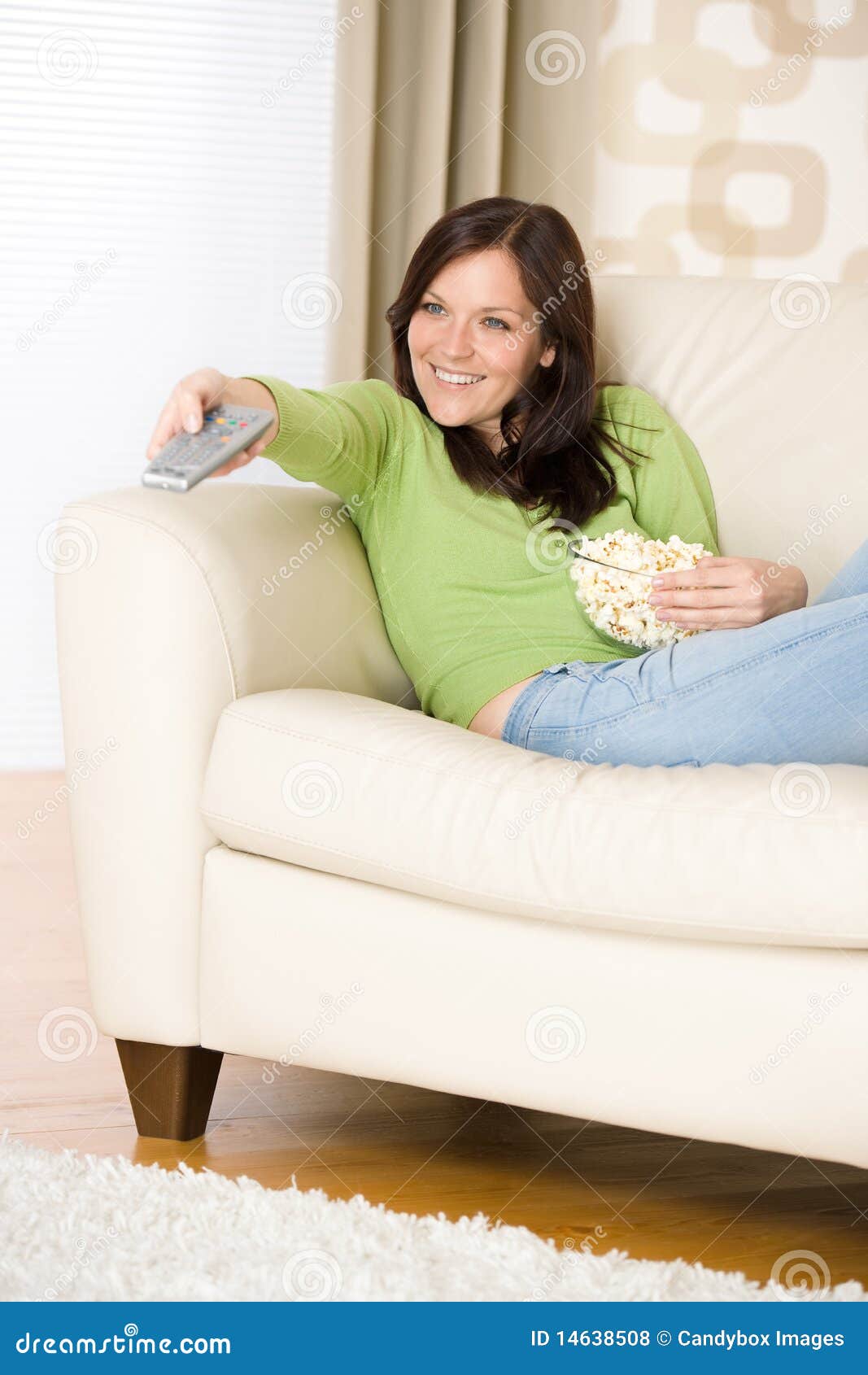 Woman Pointing with Television Remote Control Stock Photo - Image of ...