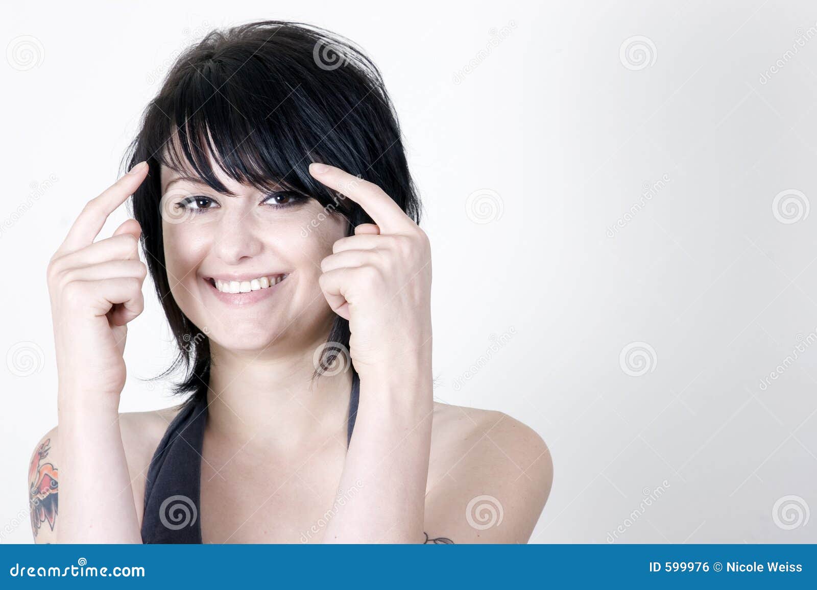 Woman pointing to head stock photo. Image of female, young - 599976