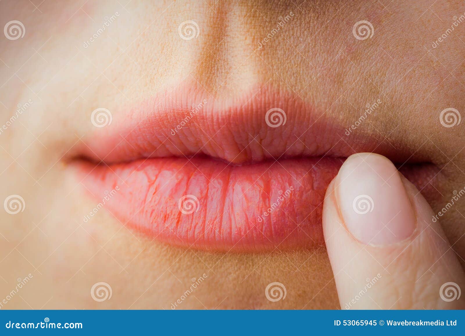 Woman pointing to her lips stock image. Image of pointing - 53065945
