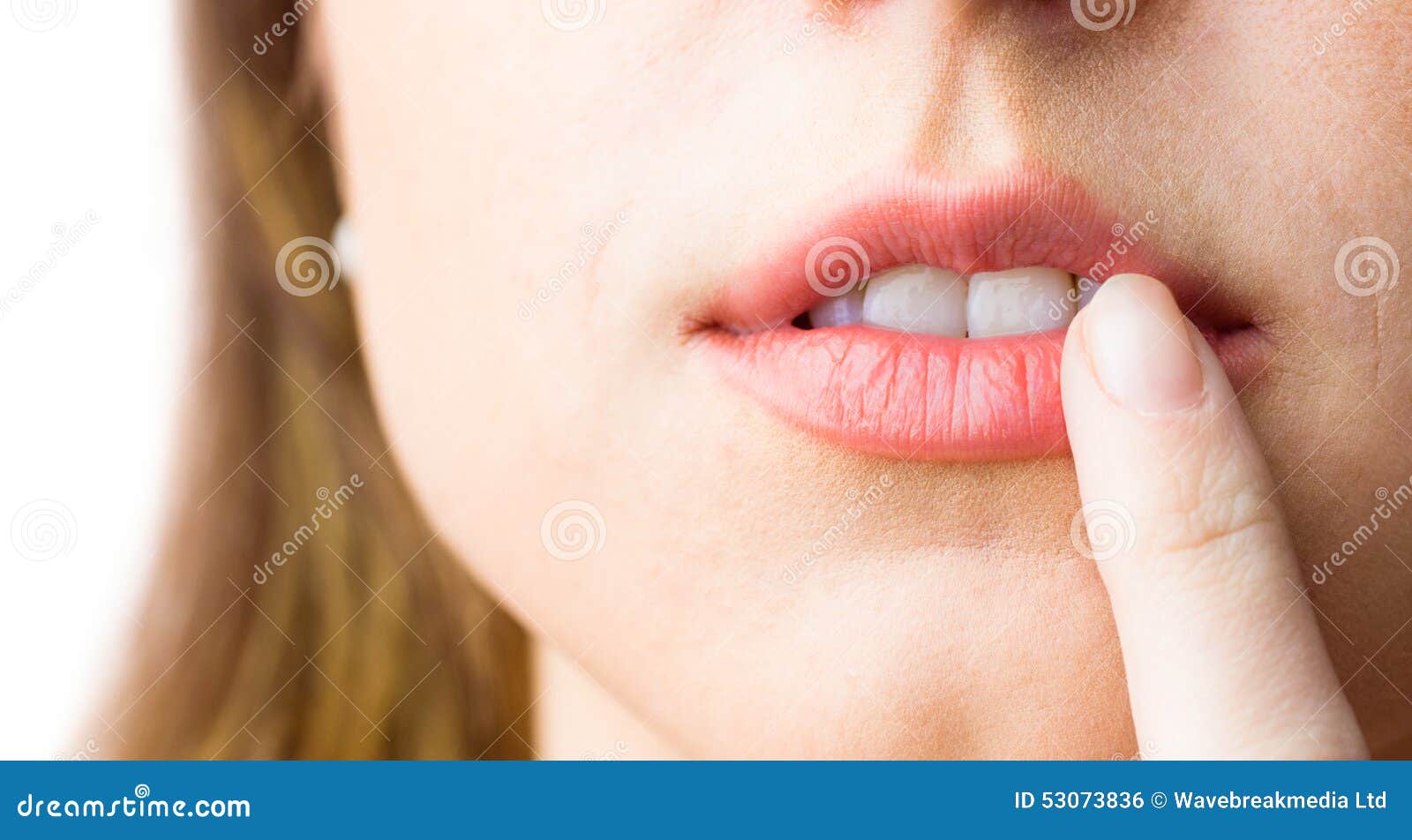 Woman pointing to her lips stock photo. Image of pretty - 53073836