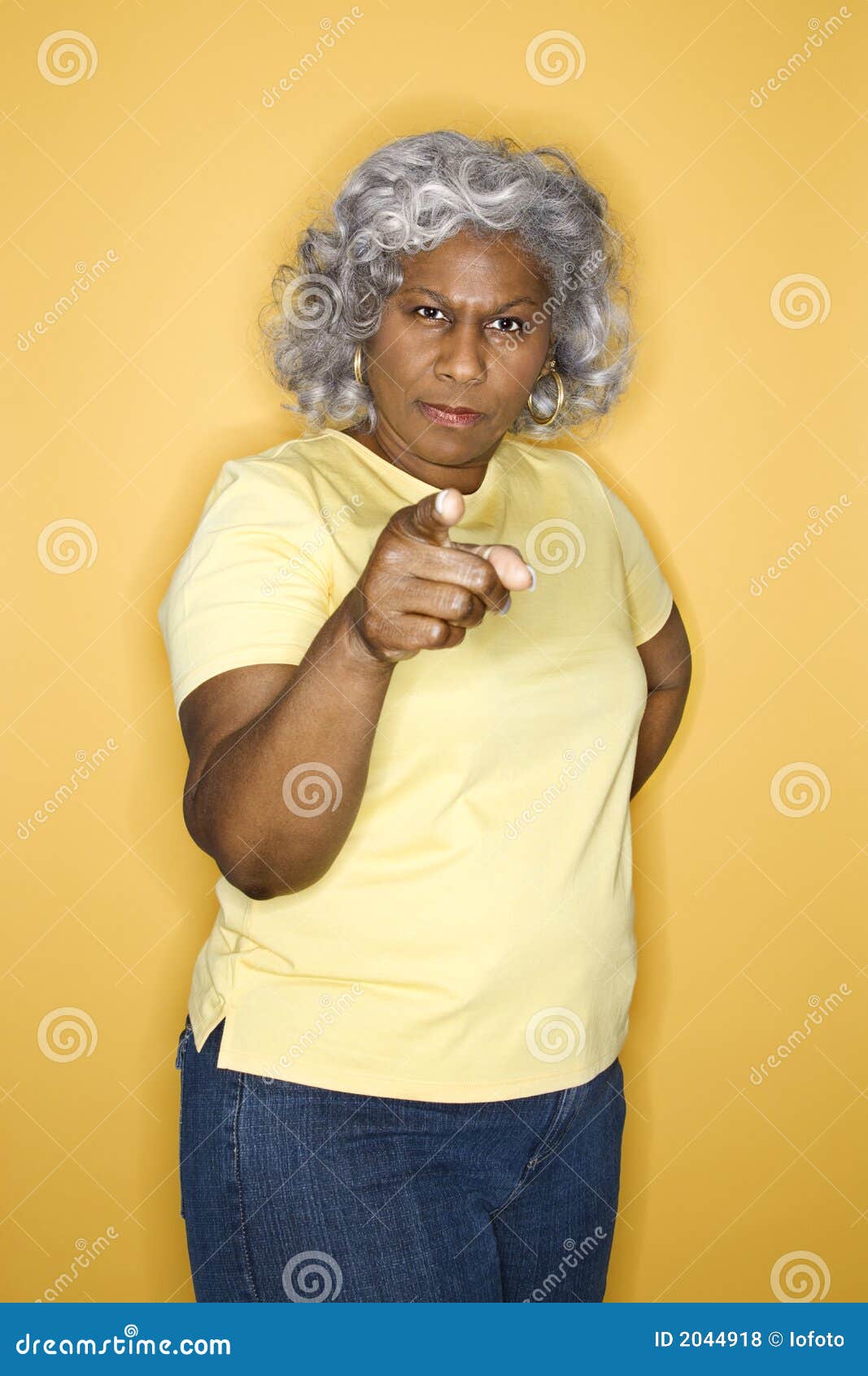 Woman pointing at viewer. stock photo. Image of person - 2044918