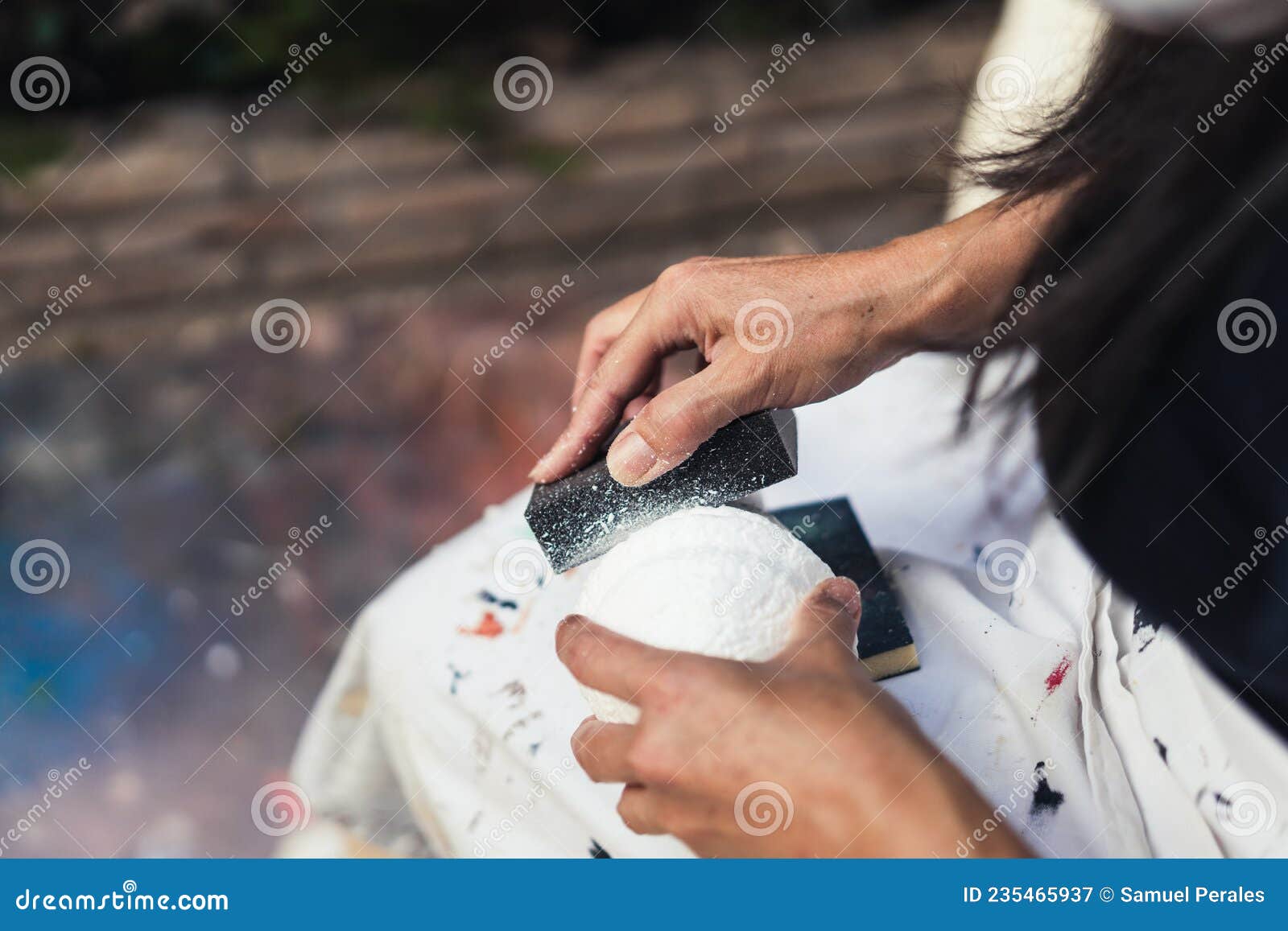 Woman Polishing a Piece of Polystyrene in a Workshop Stock Image ...
