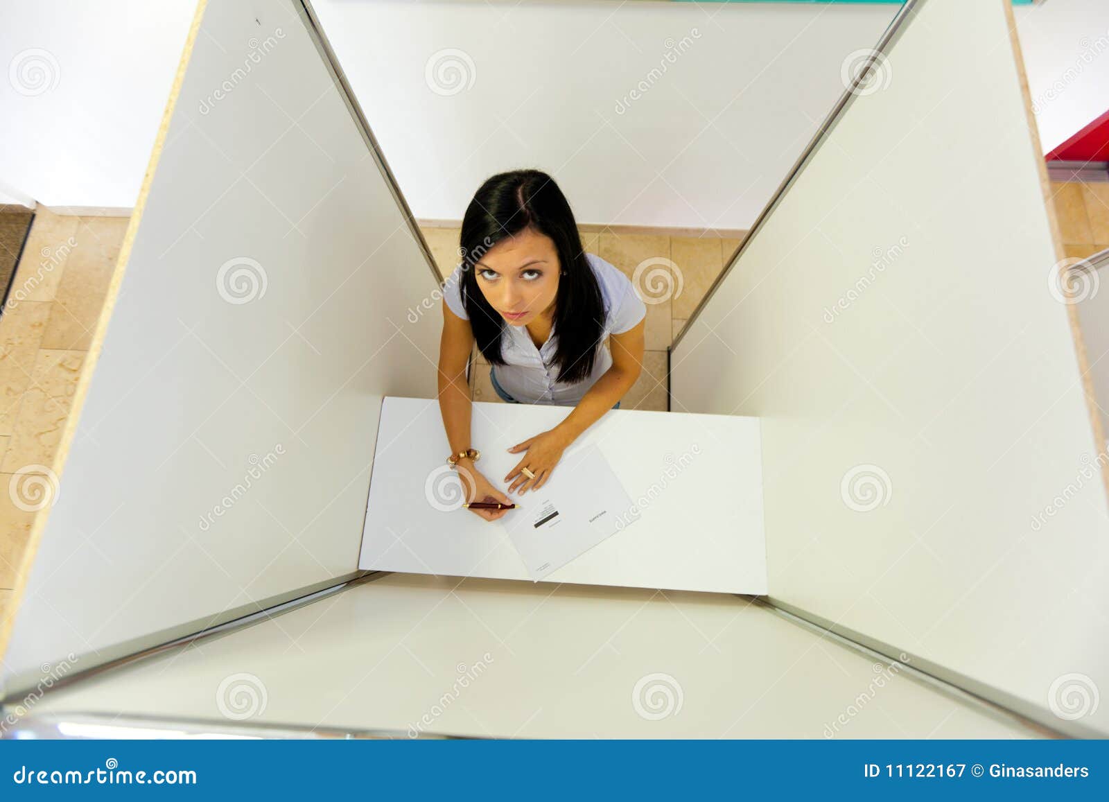 Woman in a polling booth stock image. Image of cell, booth - 11122167