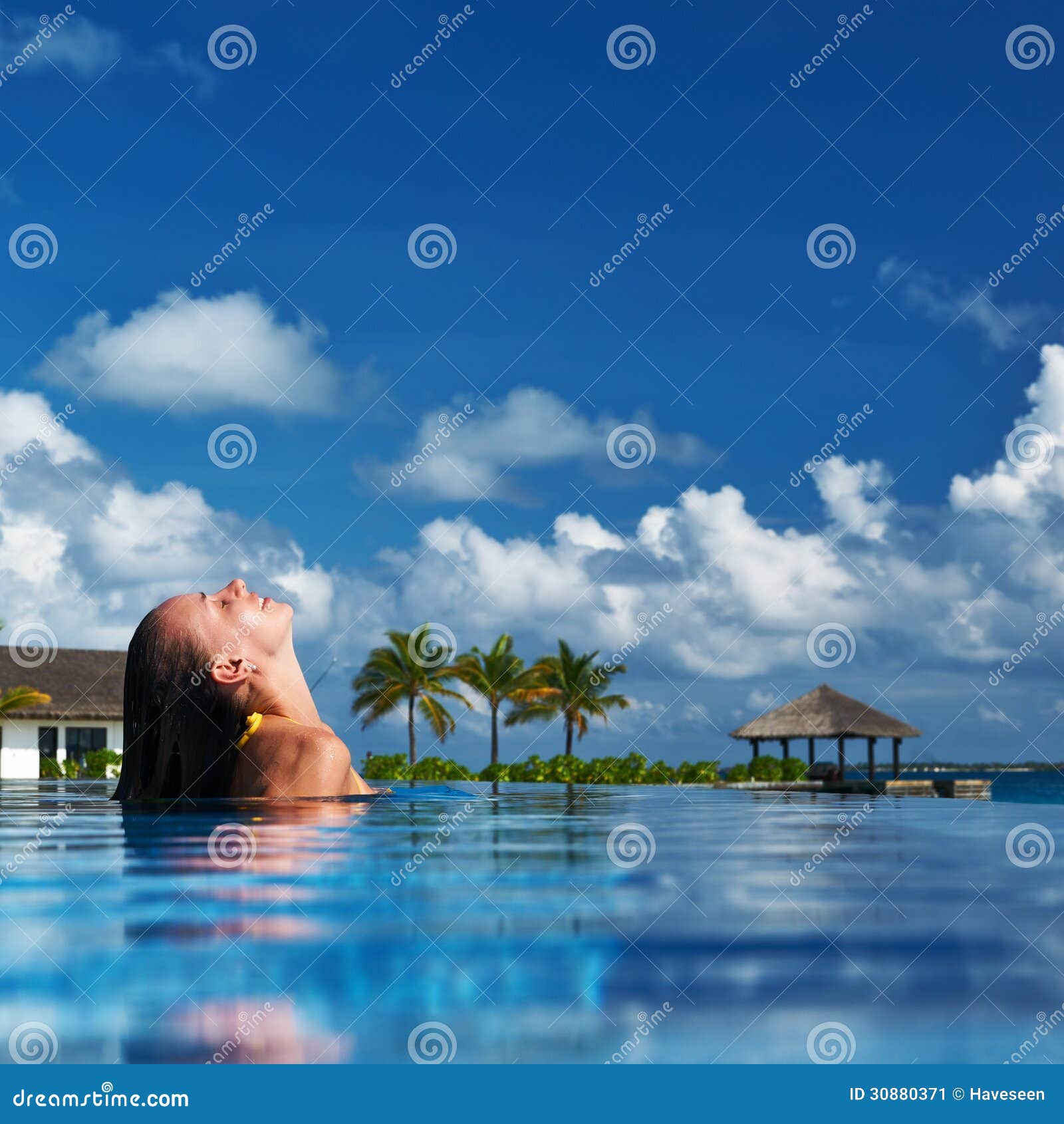 Woman at poolside stock image. Image of sunglasses, sunbath - 30880371