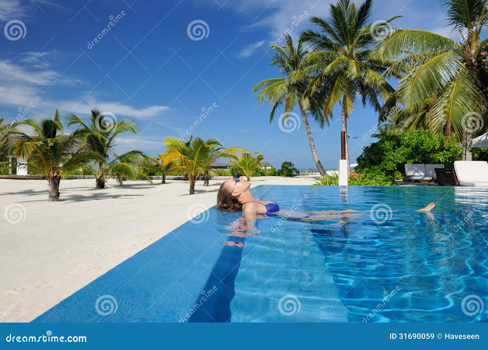 Woman at poolside stock image. Image of swimming, sensuality - 31690059