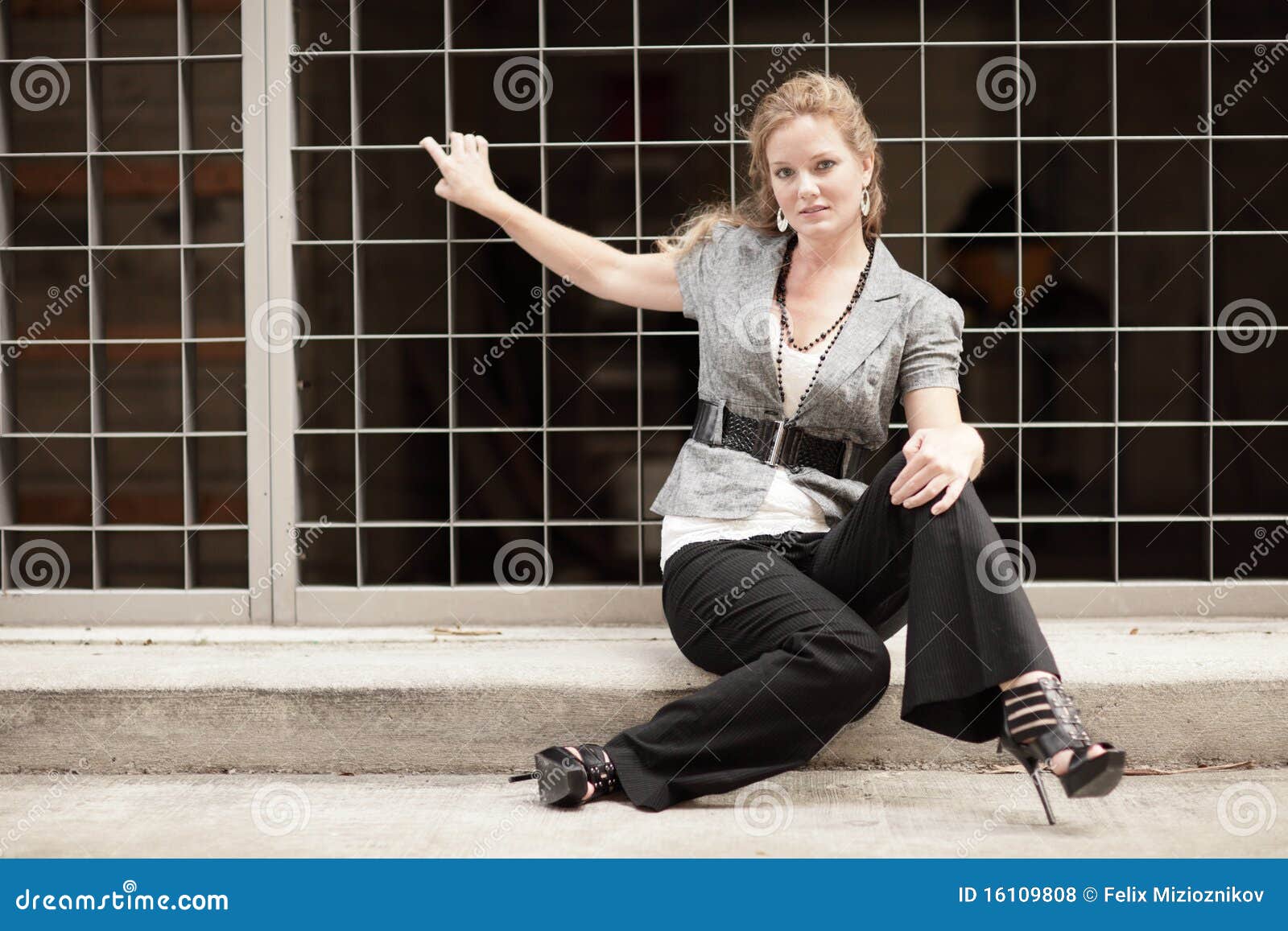 Woman Posing by an Abstract Gate Stock Photo - Image of fashion, beauty ...