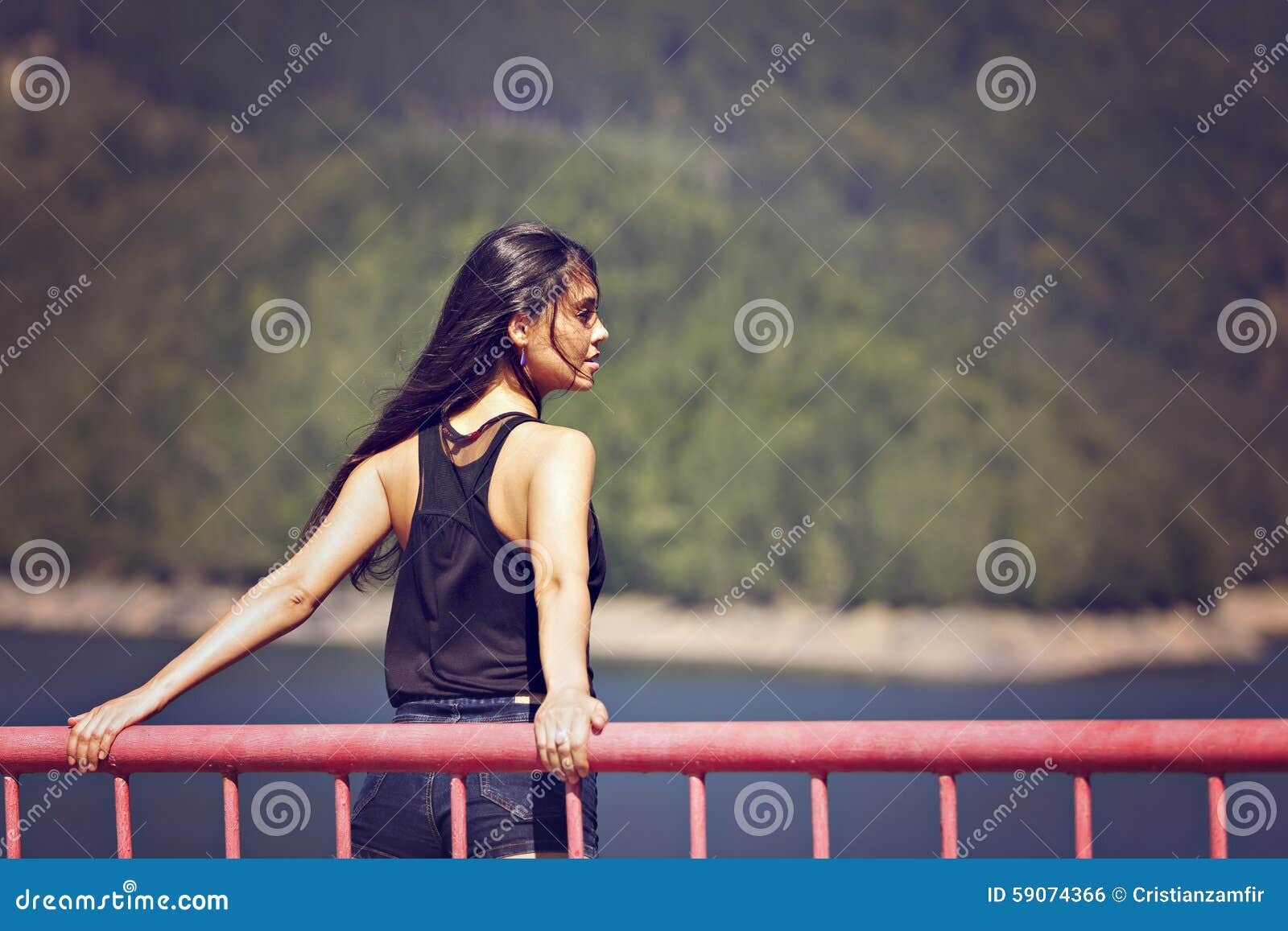 Woman posing on a bridge stock photo. Image of enjoy - 59074366