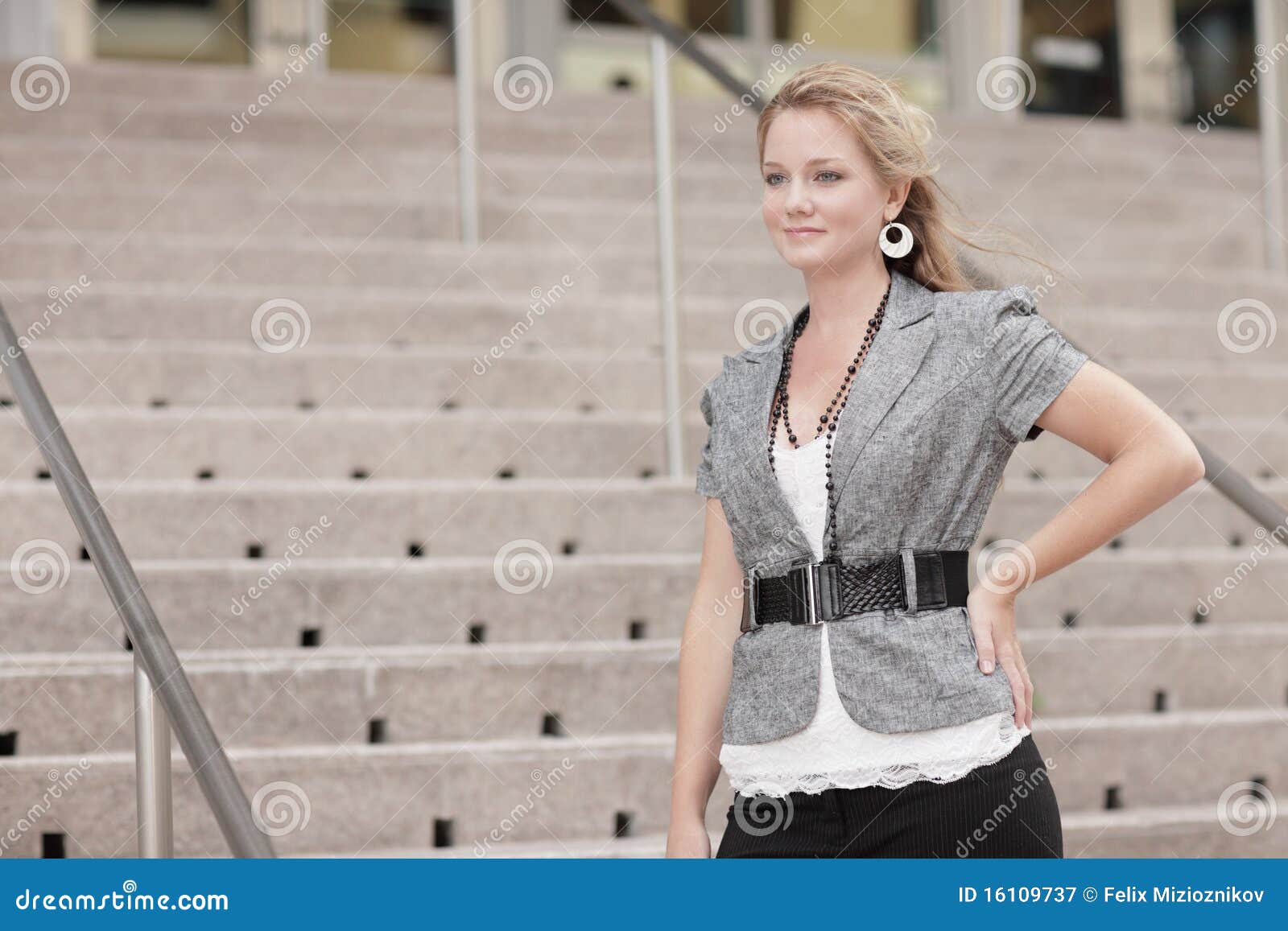 Woman posing by a building stock image. Image of blond - 16109737