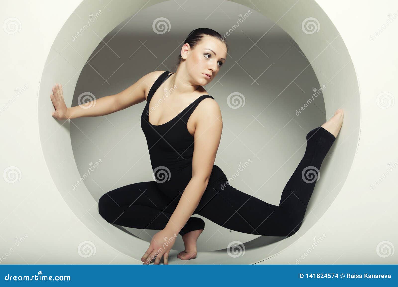 Woman posing in a circle stock photo. Image of exercise - 141824574