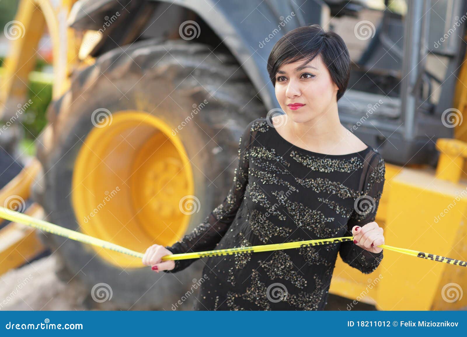 Woman Posing by Construction Equipment Stock Photo - Image of machinery ...