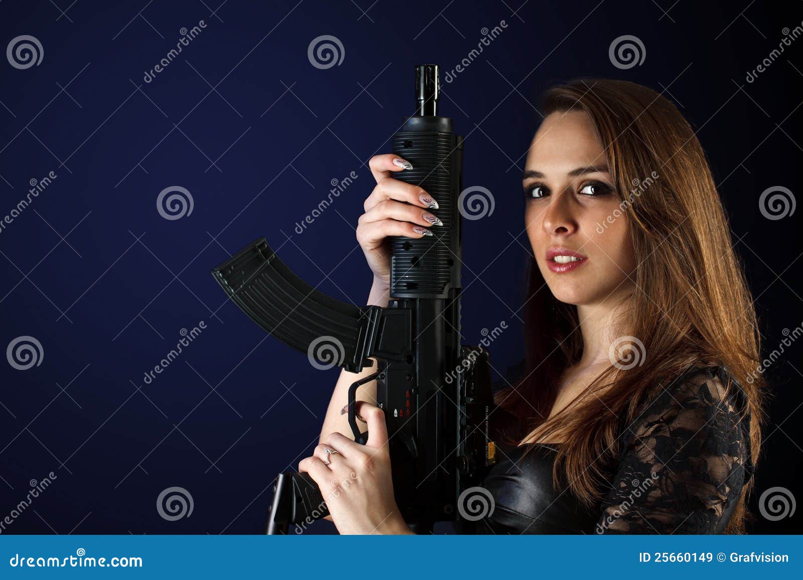 Woman posing with gun stock image. Image of beautiful - 25660149
