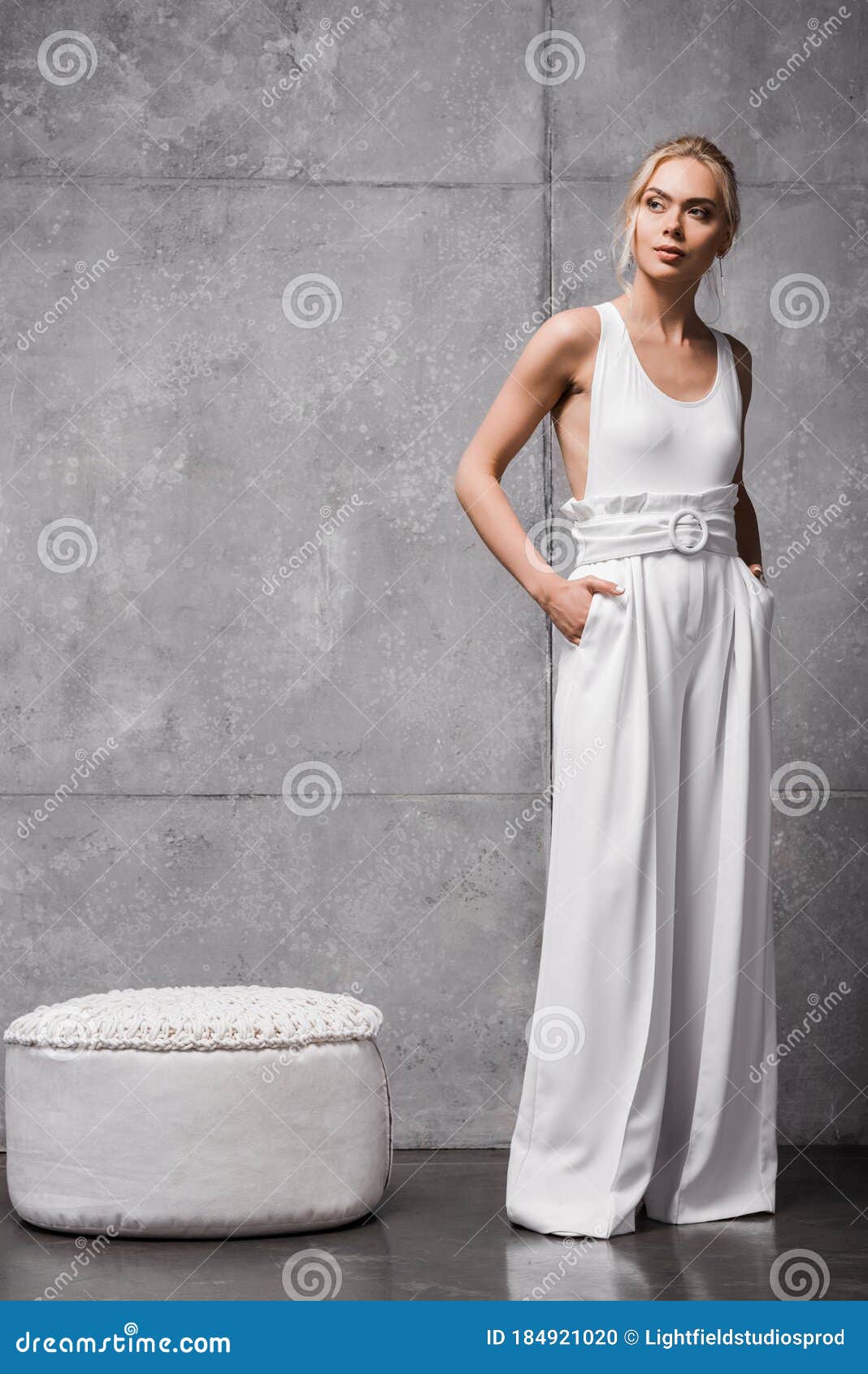 Woman Posing with Hands in Pockets on Grey Stock Photo - Image of shape ...
