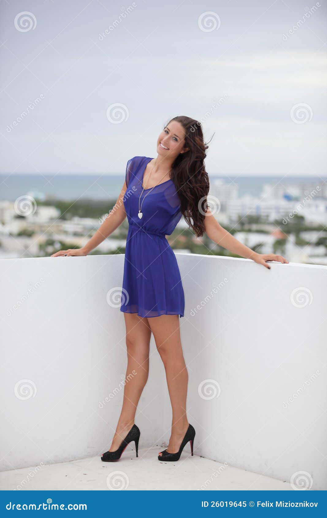 Woman posing by the ledge stock image. Image of vertical - 26019645