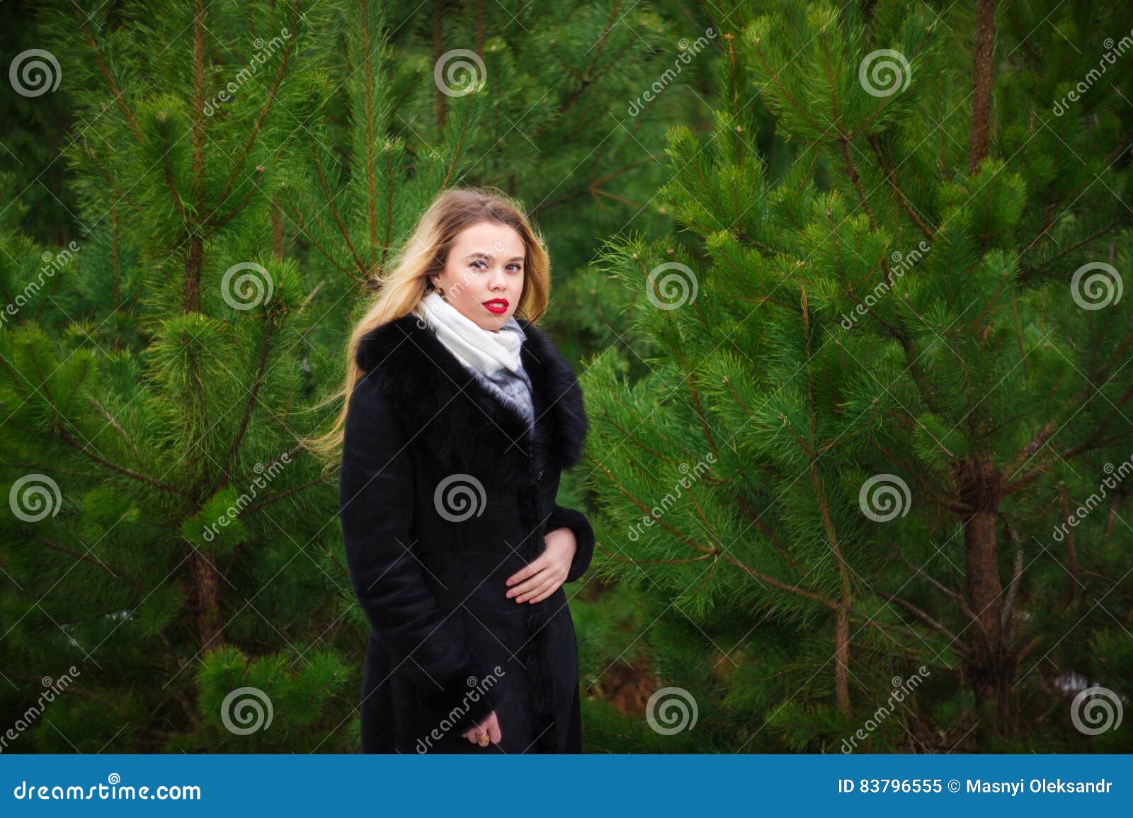 Woman posing in pines stock image. Image of green, black - 83796555