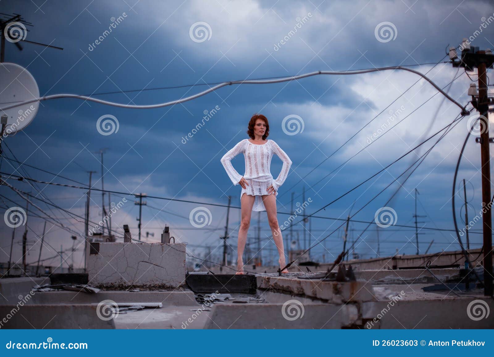 Woman posing on the roof stock image. Image of houses - 26023603