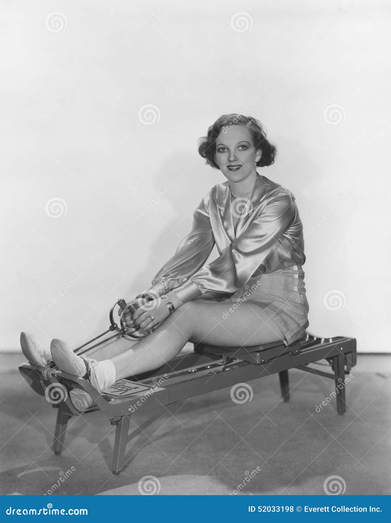 Woman Posing on Rowing Machine Stock Photo - Image of contact, body ...