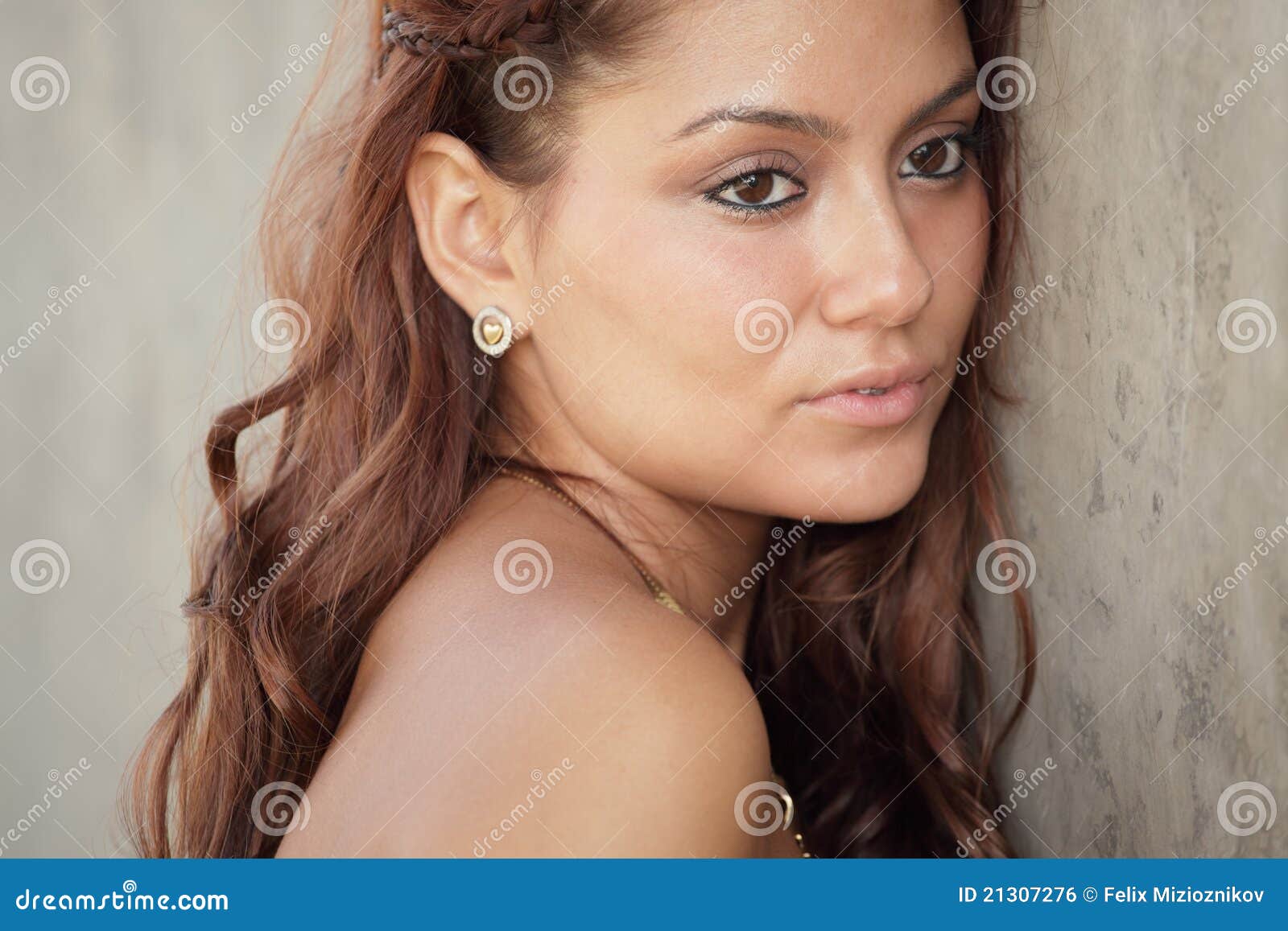 Woman posing by the wall stock photo. Image of pretty - 21307276