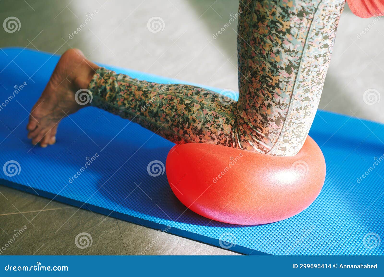 Woman Practicing Balance Pose during Pilates Training, Using Soft Ball ...