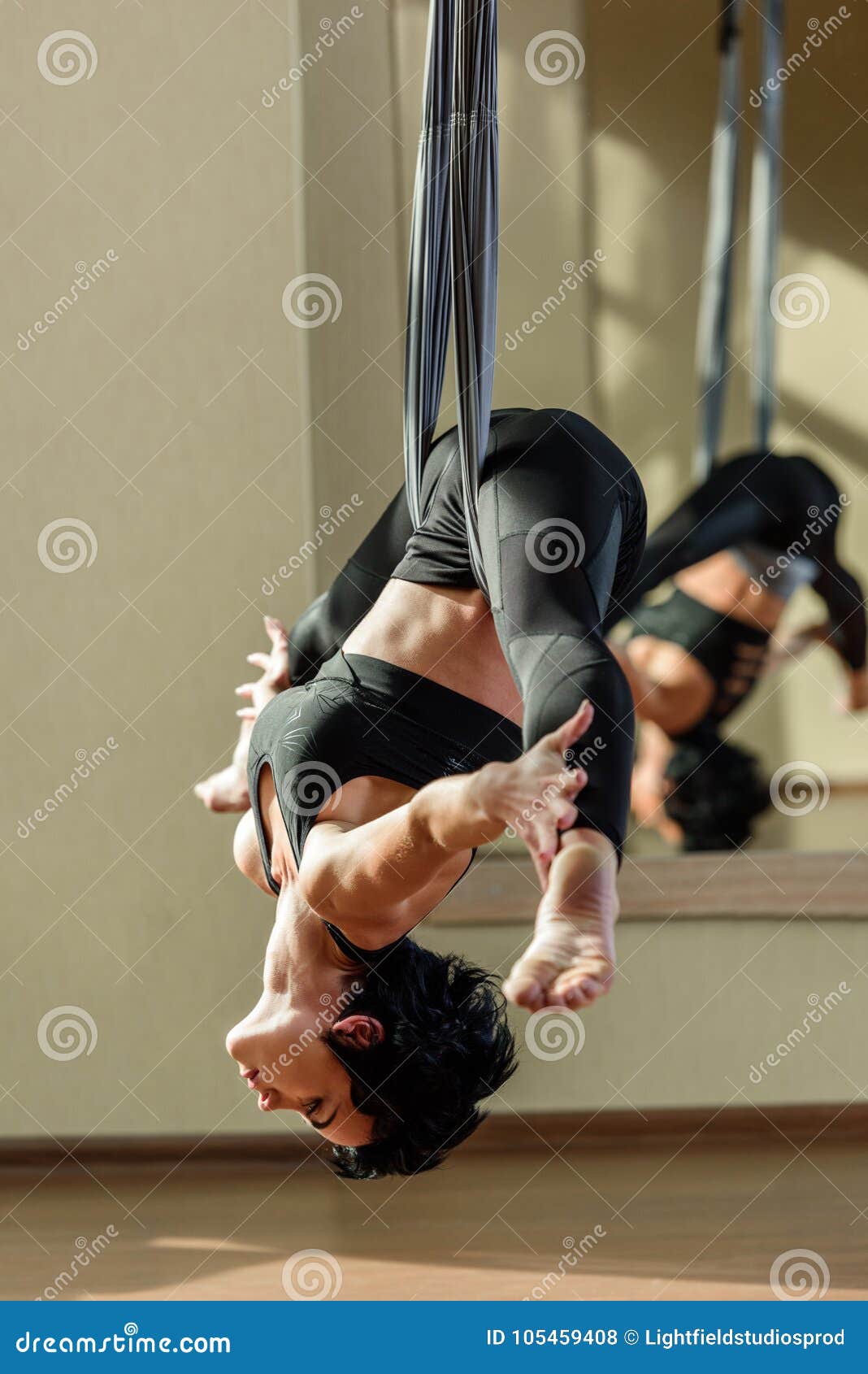 Woman practicing fly yoga stock photo. Image of acrobatic - 105459408