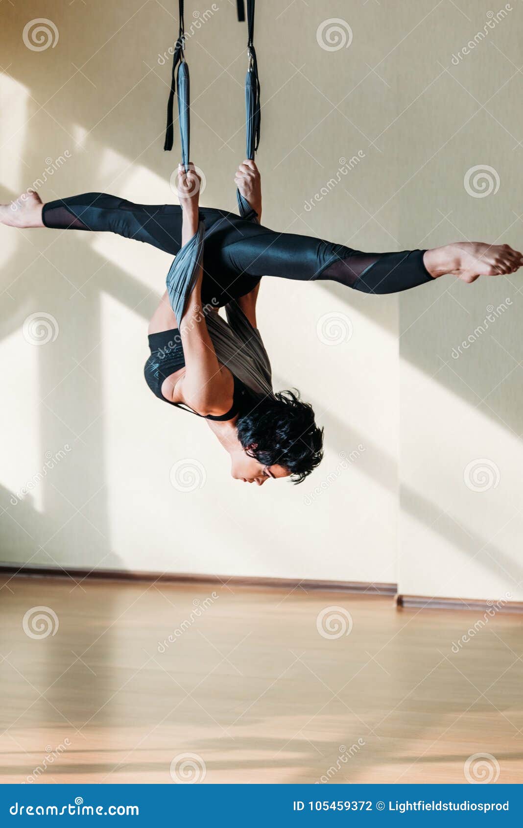 Woman practicing fly yoga stock photo. Image of pose - 105459372