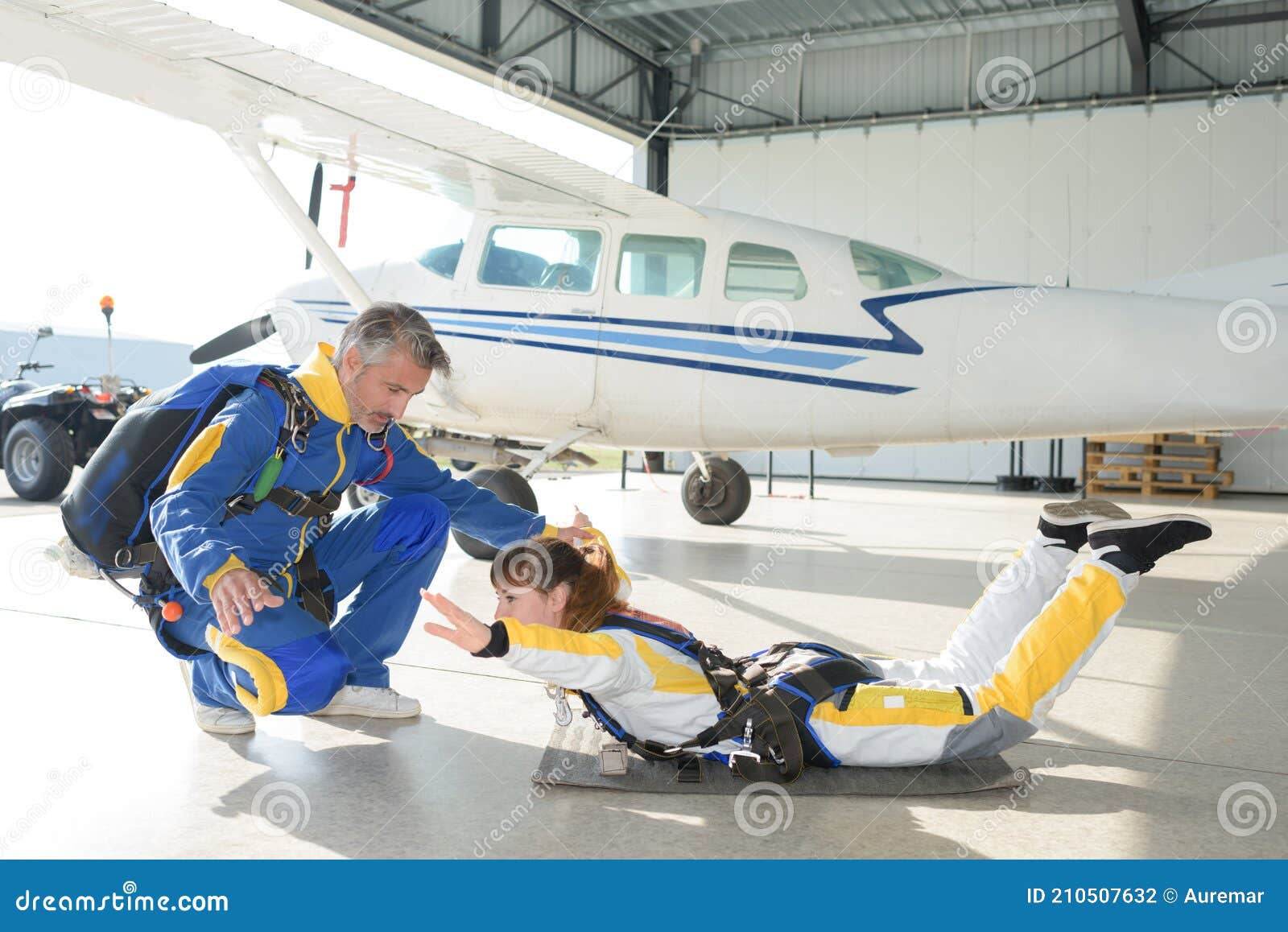Woman Practicing Position for Parachute Jump Stock Photo - Image of ...