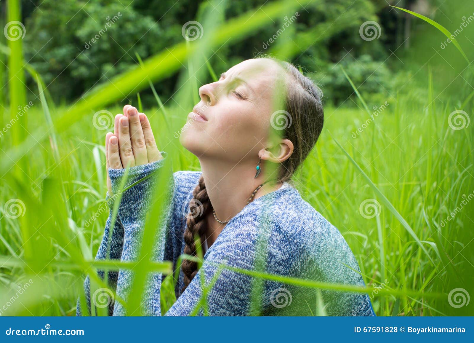 Woman Praying Outdoors in the Grass Stock Photo - Image of hand ...