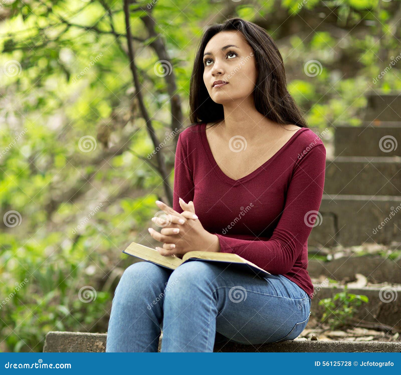 Woman praying outdoors stock photo. Image of outdoors - 56125728