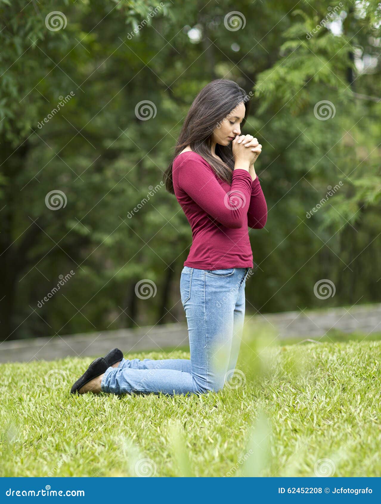 Woman praying outdoors stock photo. Image of outdoors - 62452208