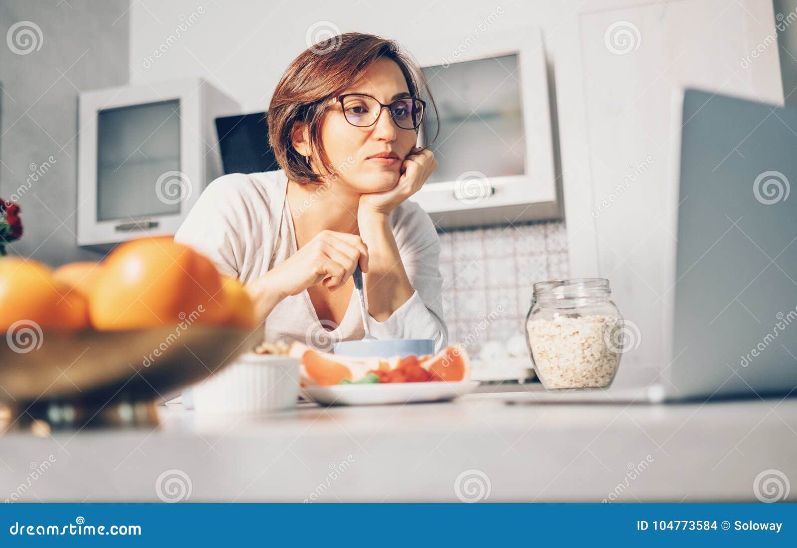 Woman Prepare Breakfast and Watch Laptop on Kitchen Stock Photo - Image ...