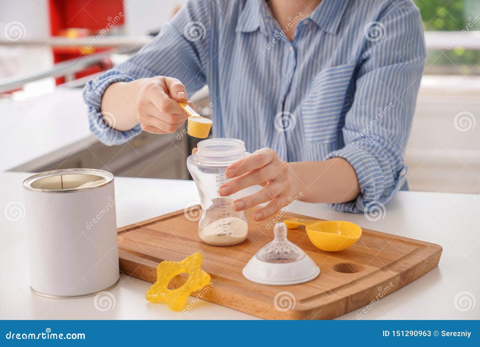 Woman Preparing Baby Formula at Table Stock Image - Image of background ...