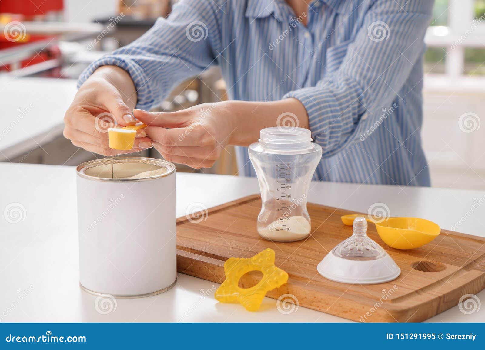Woman Preparing Baby Formula at Table Stock Image - Image of baby ...