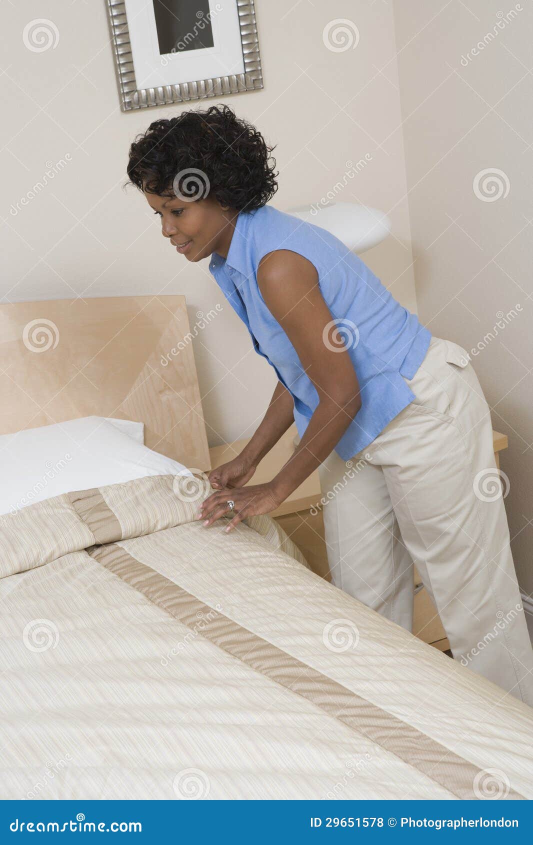 Woman Preparing Bed at Home Stock Photo - Image of middle, person: 29651578