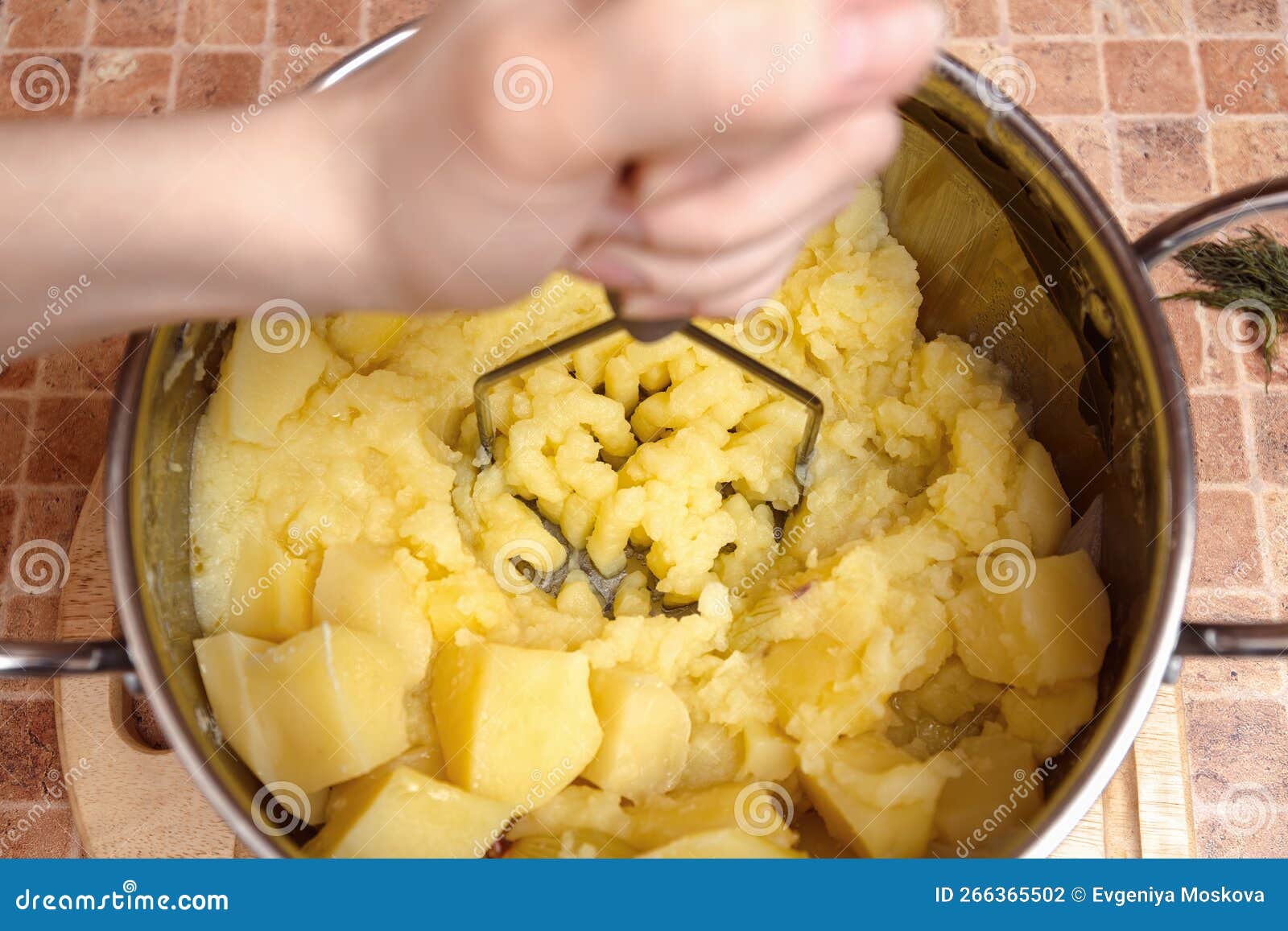 Woman Preparing Mashed Potatoes with Stainless Potato Masher. Cooking ...