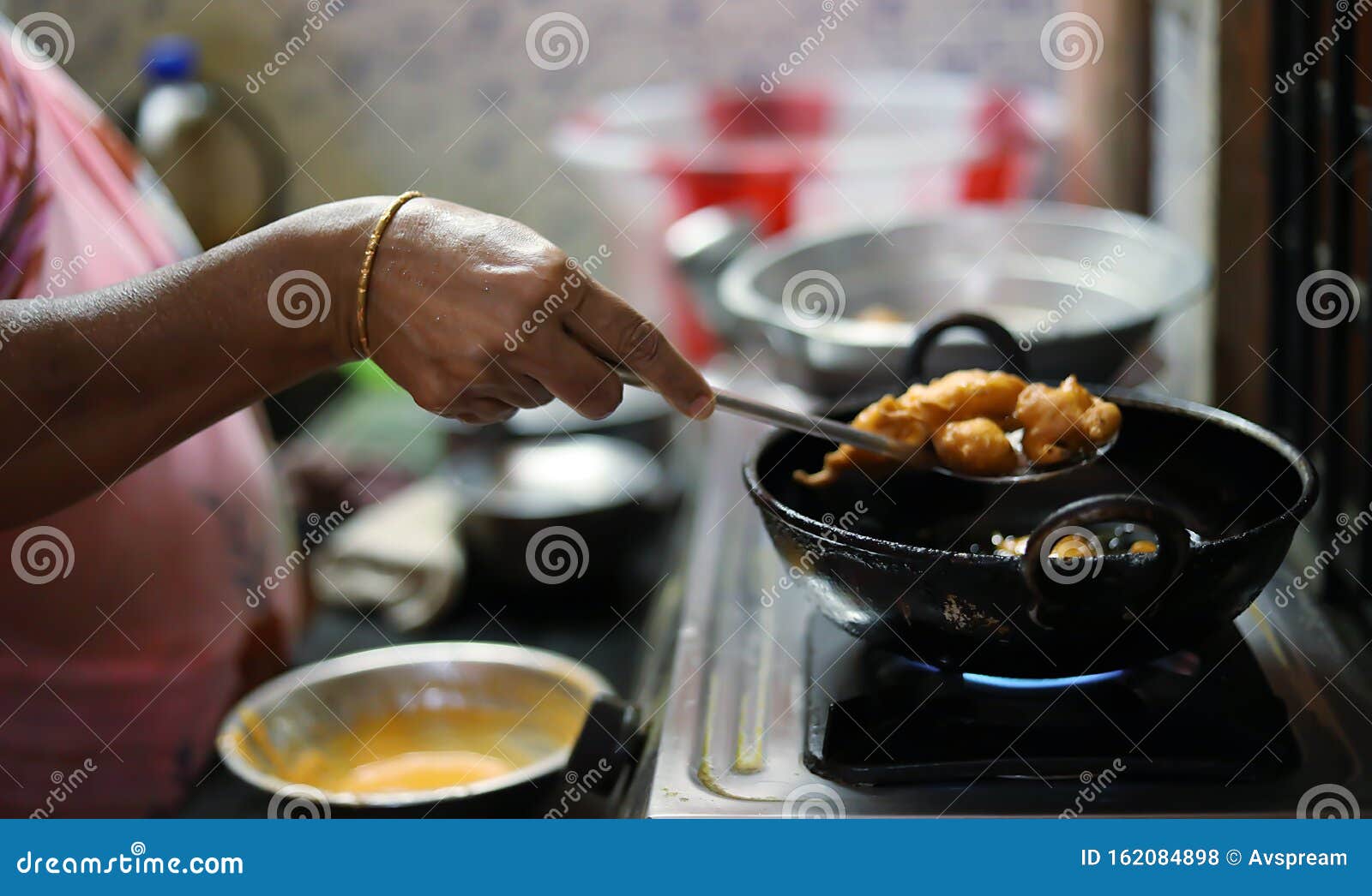 Woman Preparing Snacks at Kitchen Counter Stock Photo - Image of asia ...