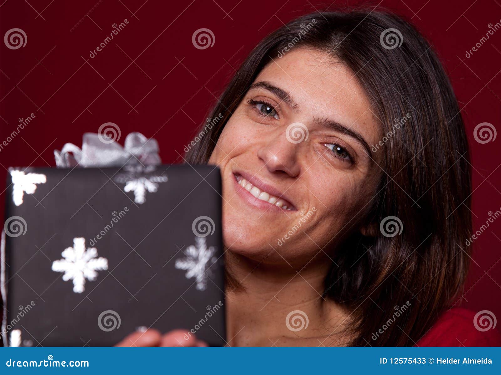 Woman with a present stock image. Image of positive, pretty - 12575433