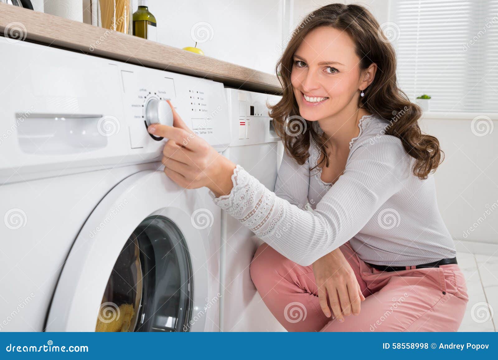 Woman Pressing Button of Washing Machine Stock Photo - Image of house ...