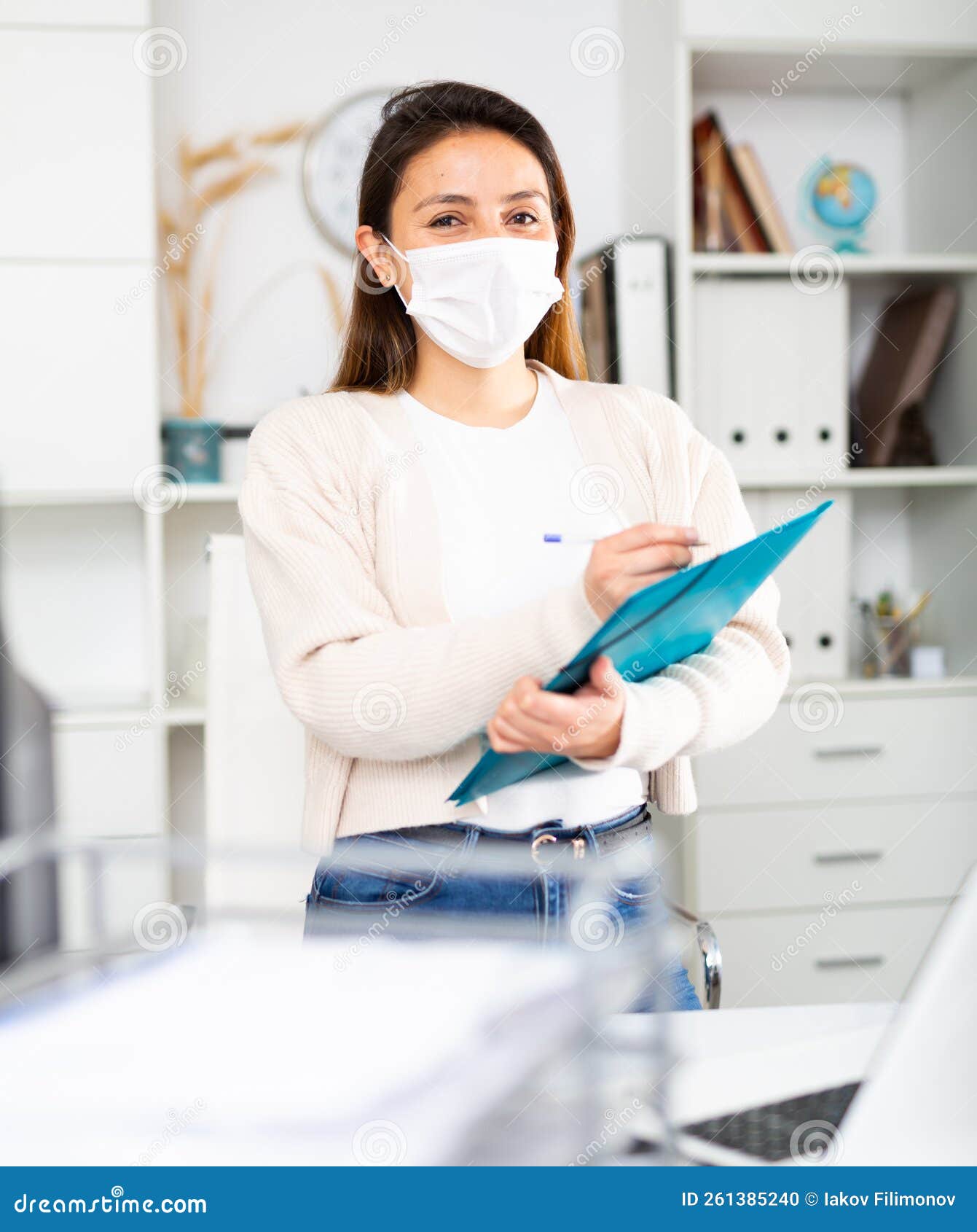 Woman in Protective Mask with Blue Folder of Documents Stands Stock ...