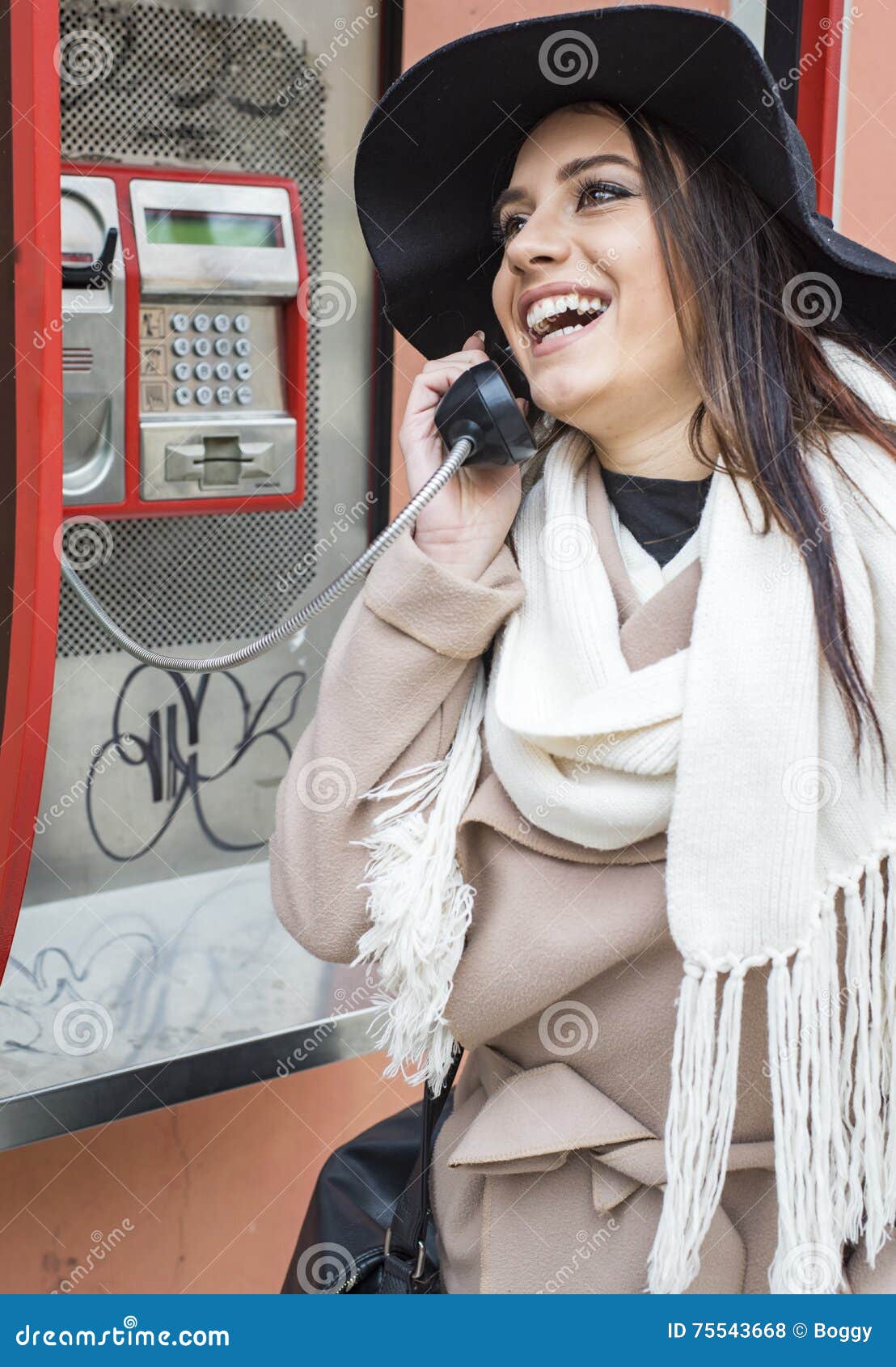 Woman on public phone stock photo. Image of attractive - 75543668