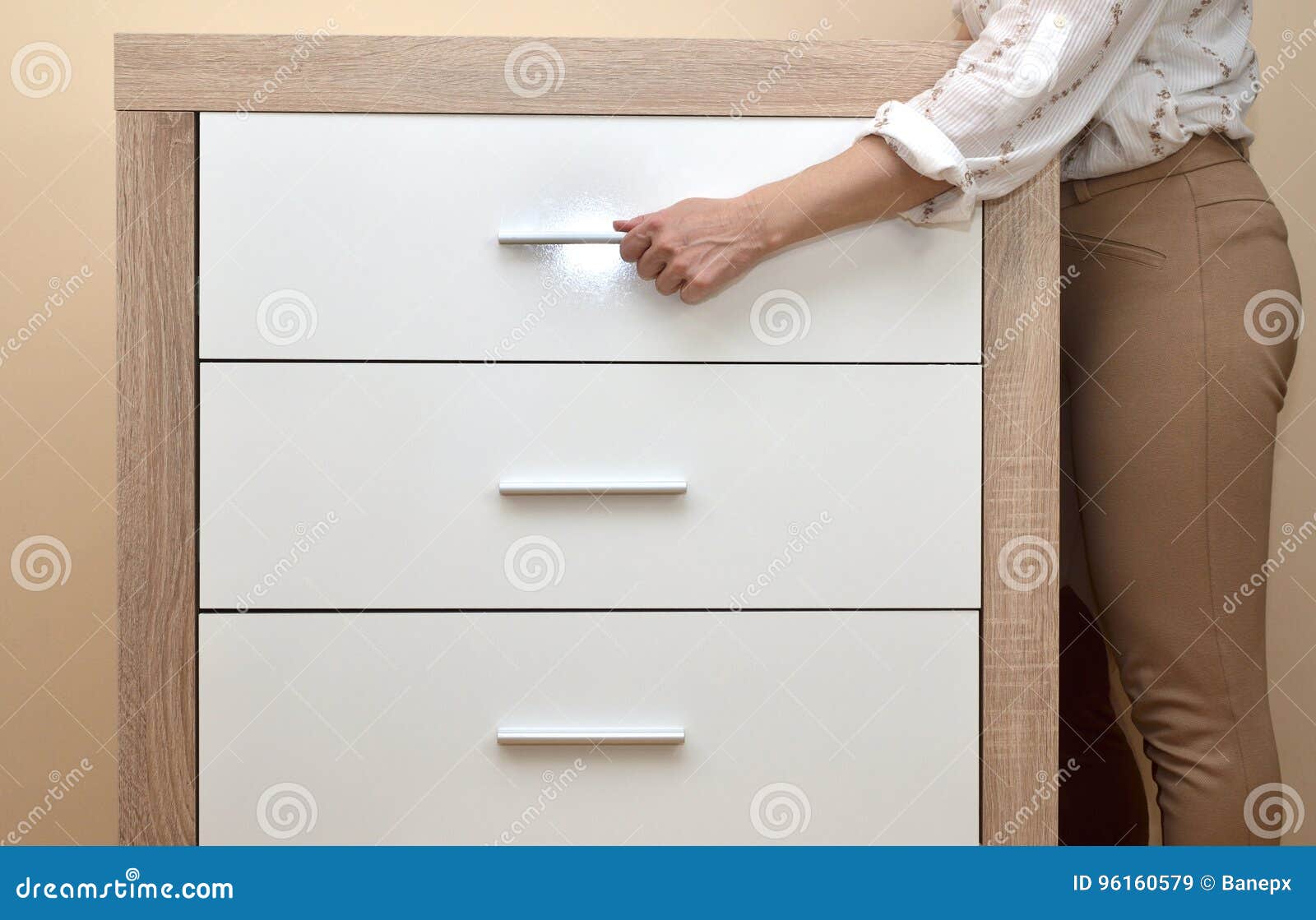 Woman Pulling Drawer stock image. Image of pull, push - 96160579