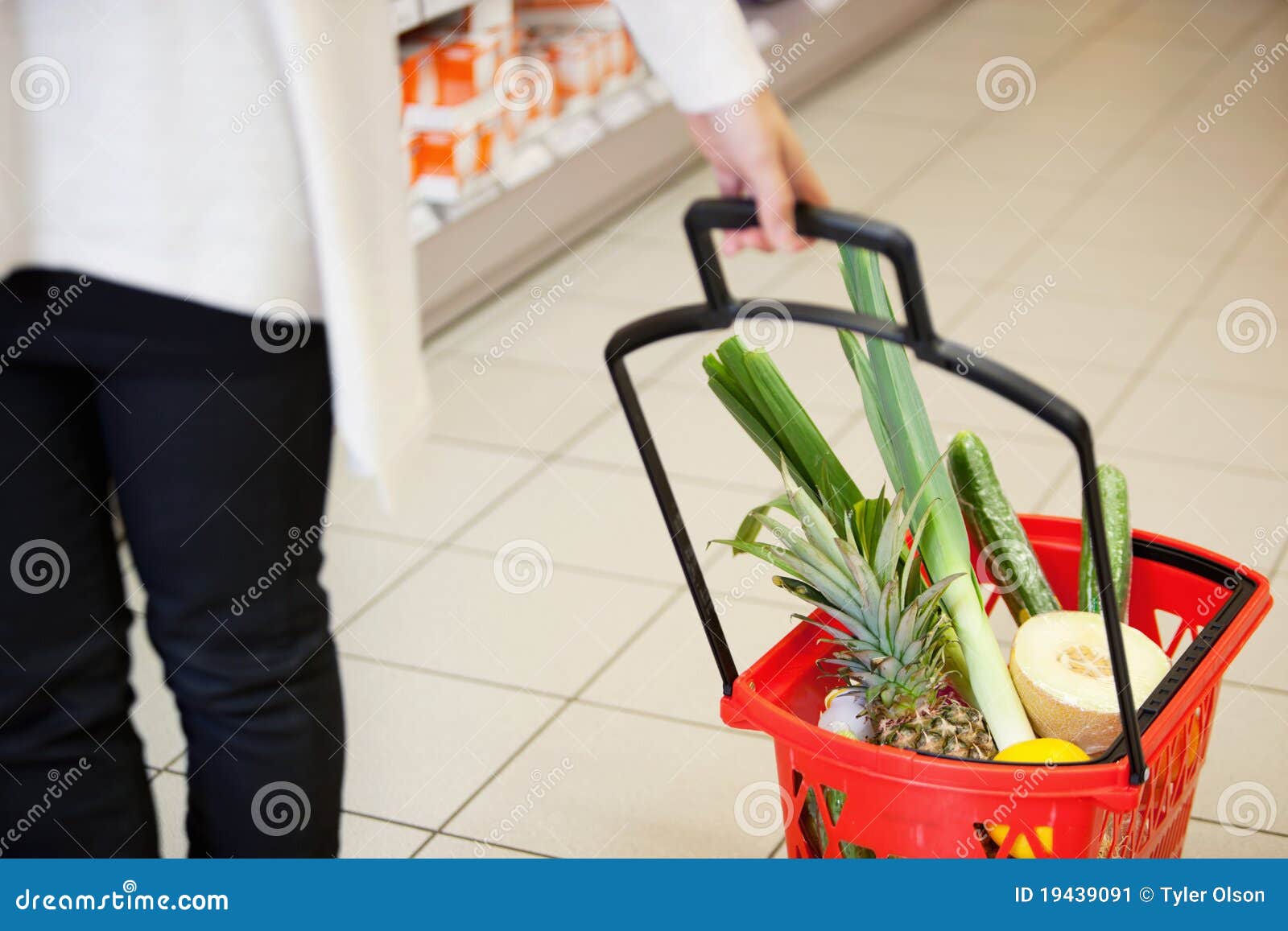 Woman Pulling Shopping Basket in Grocery Store Stock Image - Image of ...