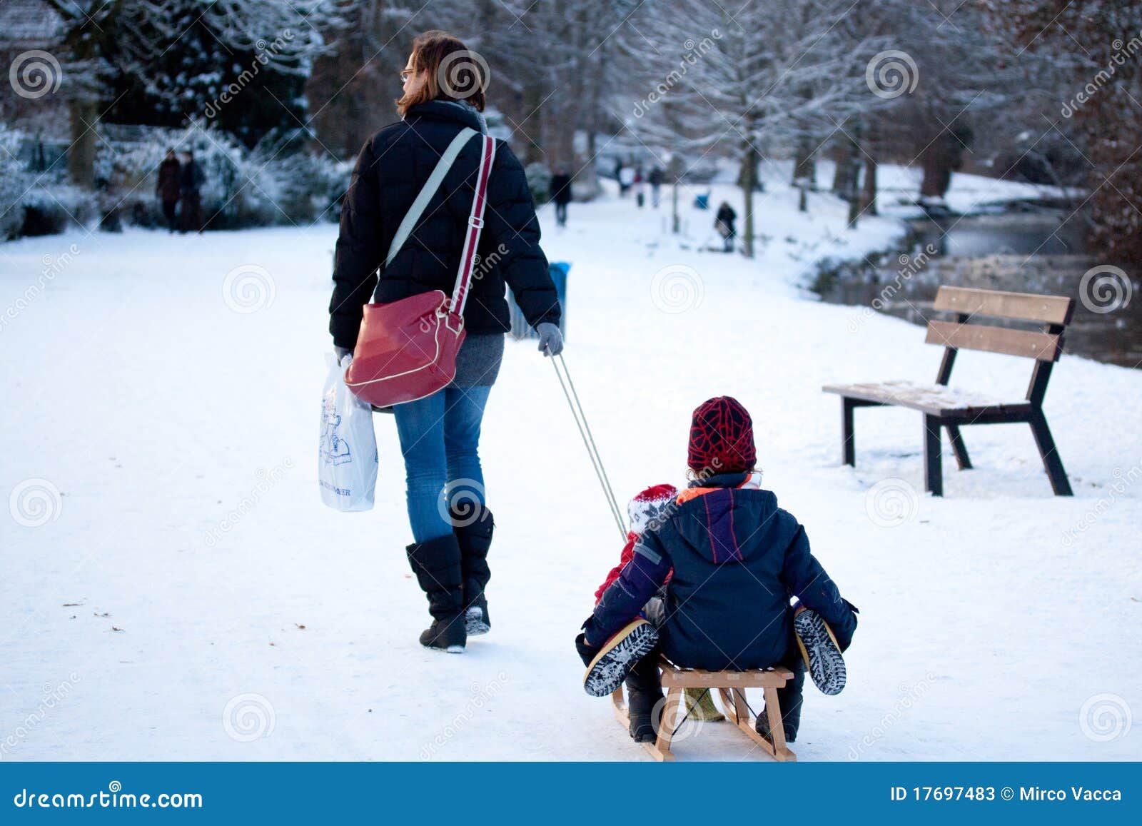 Woman Pulling a Sled with Two Kids on it Editorial Stock Photo - Image ...