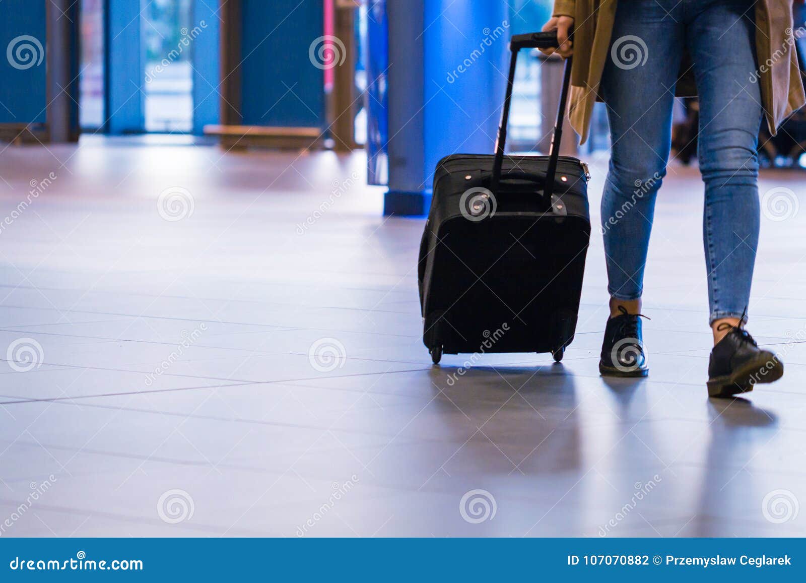 Woman pulling the suitcase stock photo. Image of young - 107070882
