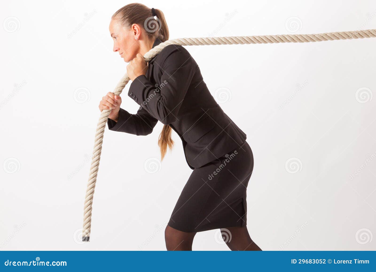 A Woman is Pulling at a Thick Rope Stock Photo - Image of woman, pull ...
